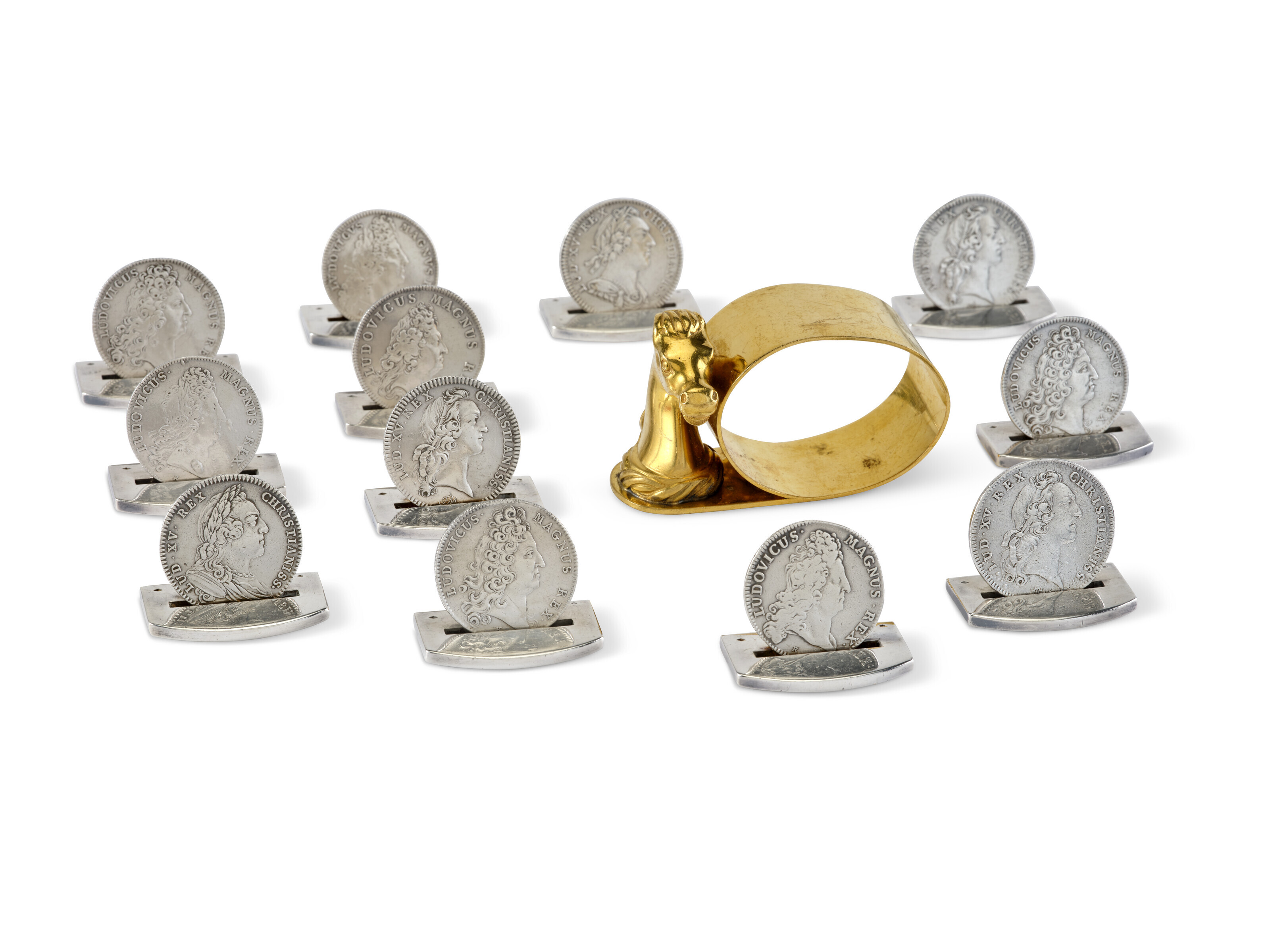 A GROUP OF THIRTEEN: A GOLD PLATED NAPKIN RING AND TWELVE SILVER PLATED ...