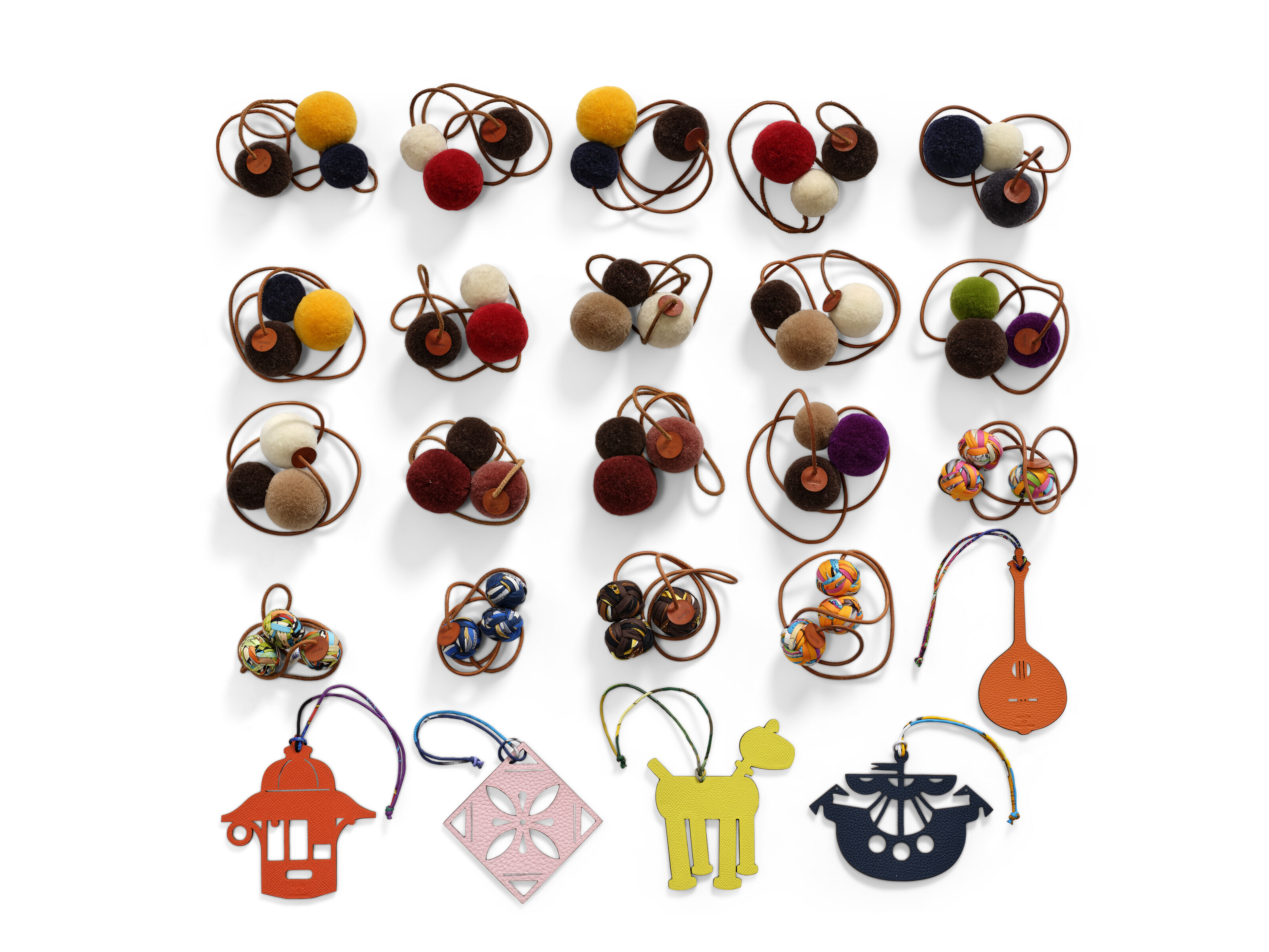 A GROUP OF TWENTY FOUR: FOURTEEN PAIRS OF WOOL POM-POM CHARMS, FIVE ...