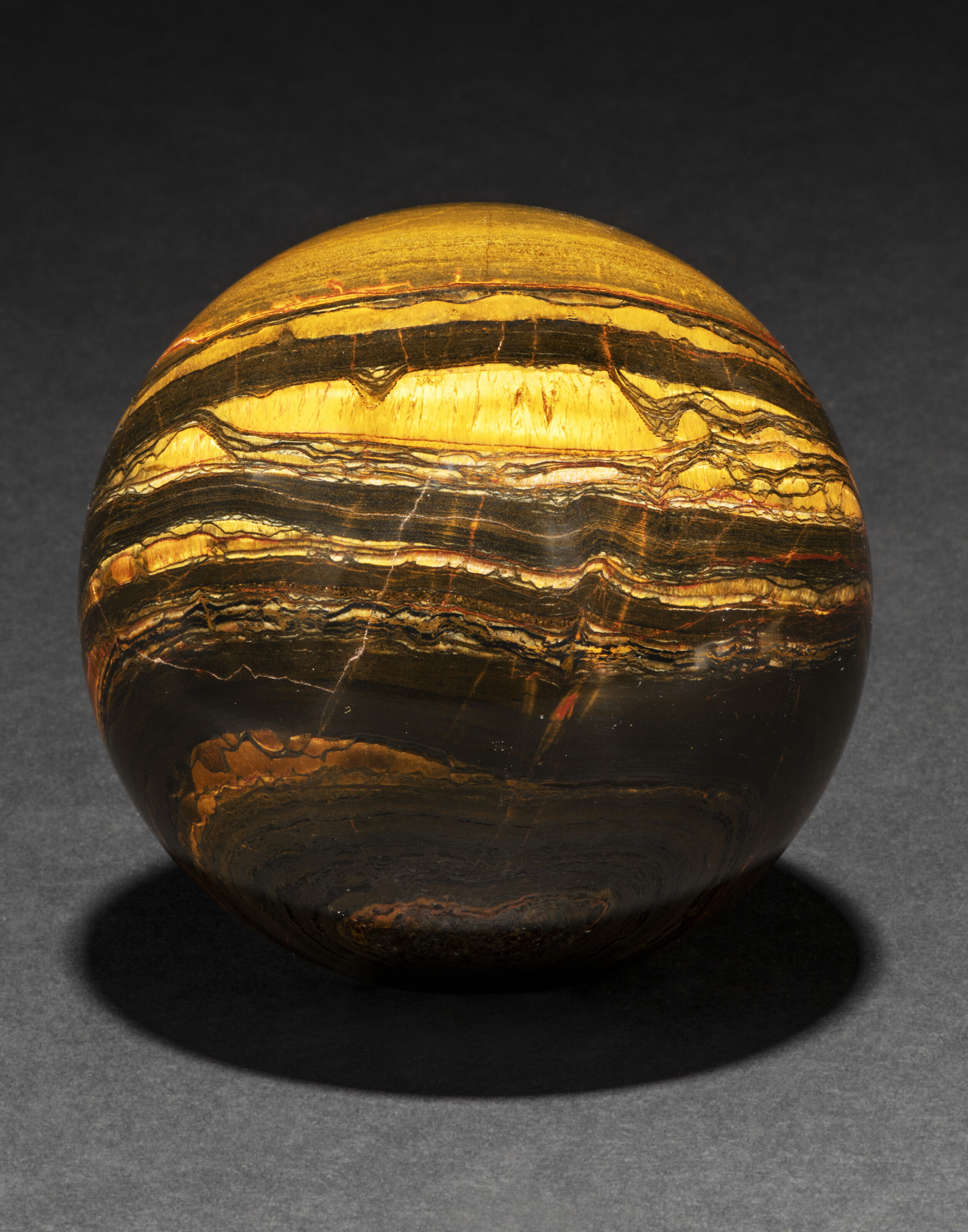 A LARGE SPHERE OF BANDED IRON TIGER EYE, Australia | Christie’s