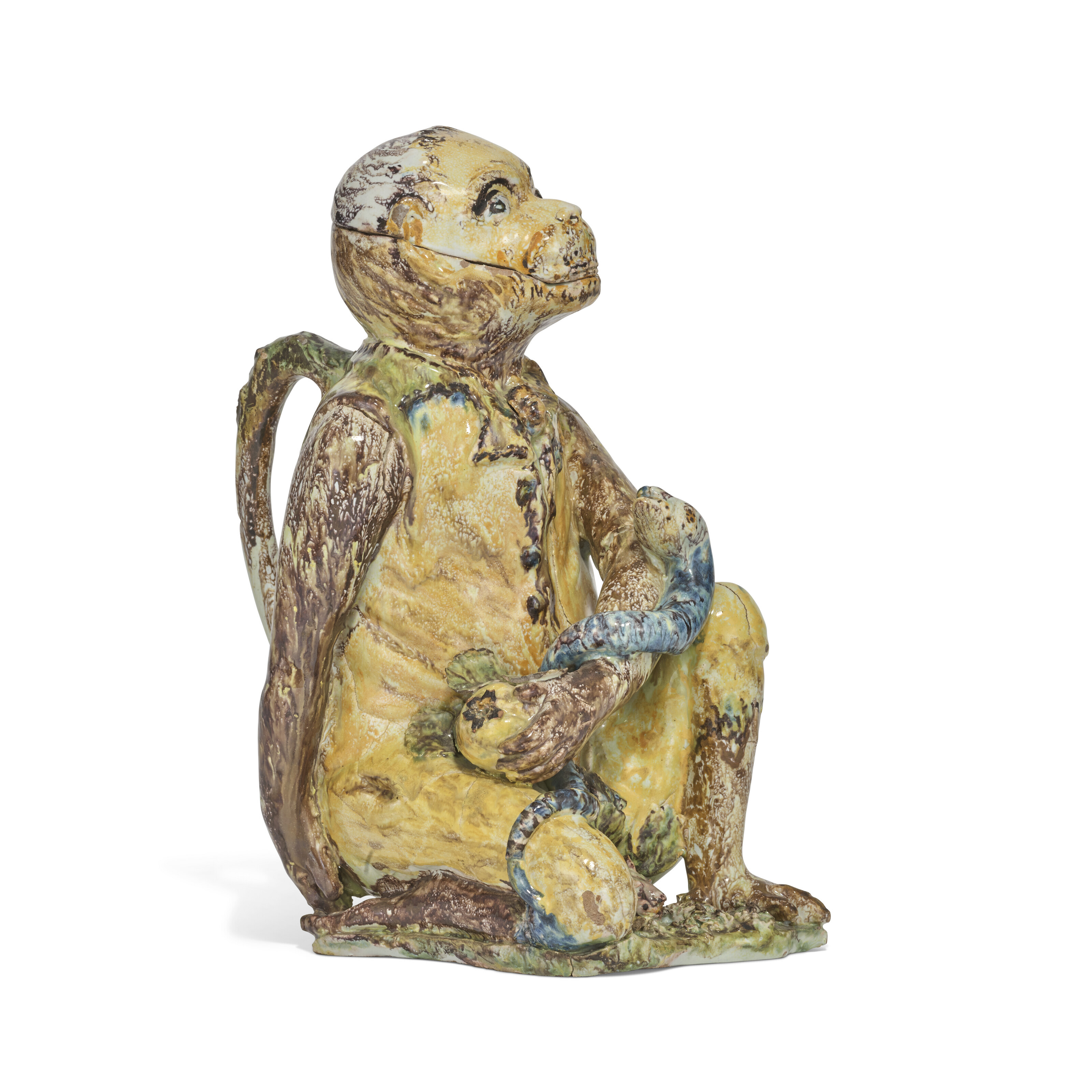 A CONTINENTAL FAYENCE JUG AND COVER MODELLED AS A MONKEY, CIRCA 1770 ...