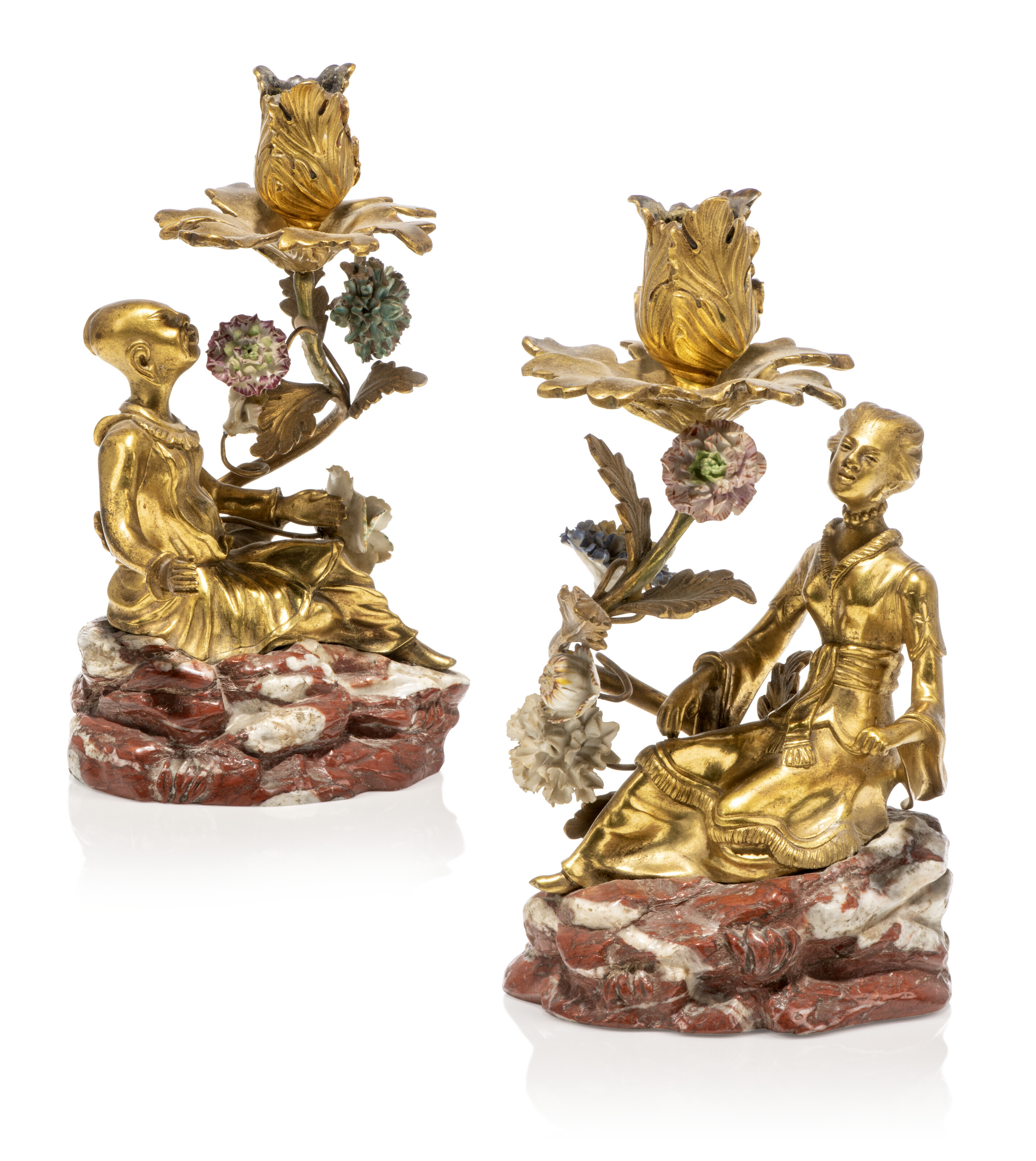 A PAIR OF FRENCH ORMOLU AND PORCELAIN 'MAGOT' CANDLESTICKS, SECOND HALF ...