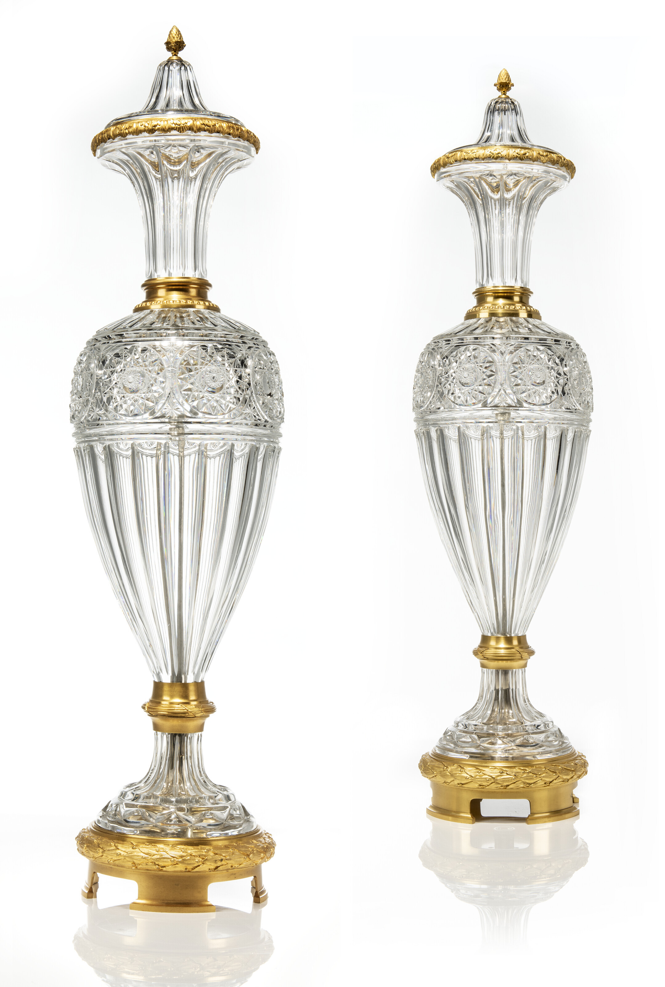 A NEAR PAIR OF LARGE FRENCH ORMOLU-MOUNTED CUT-CRYSTAL BALUSTER VASES ...