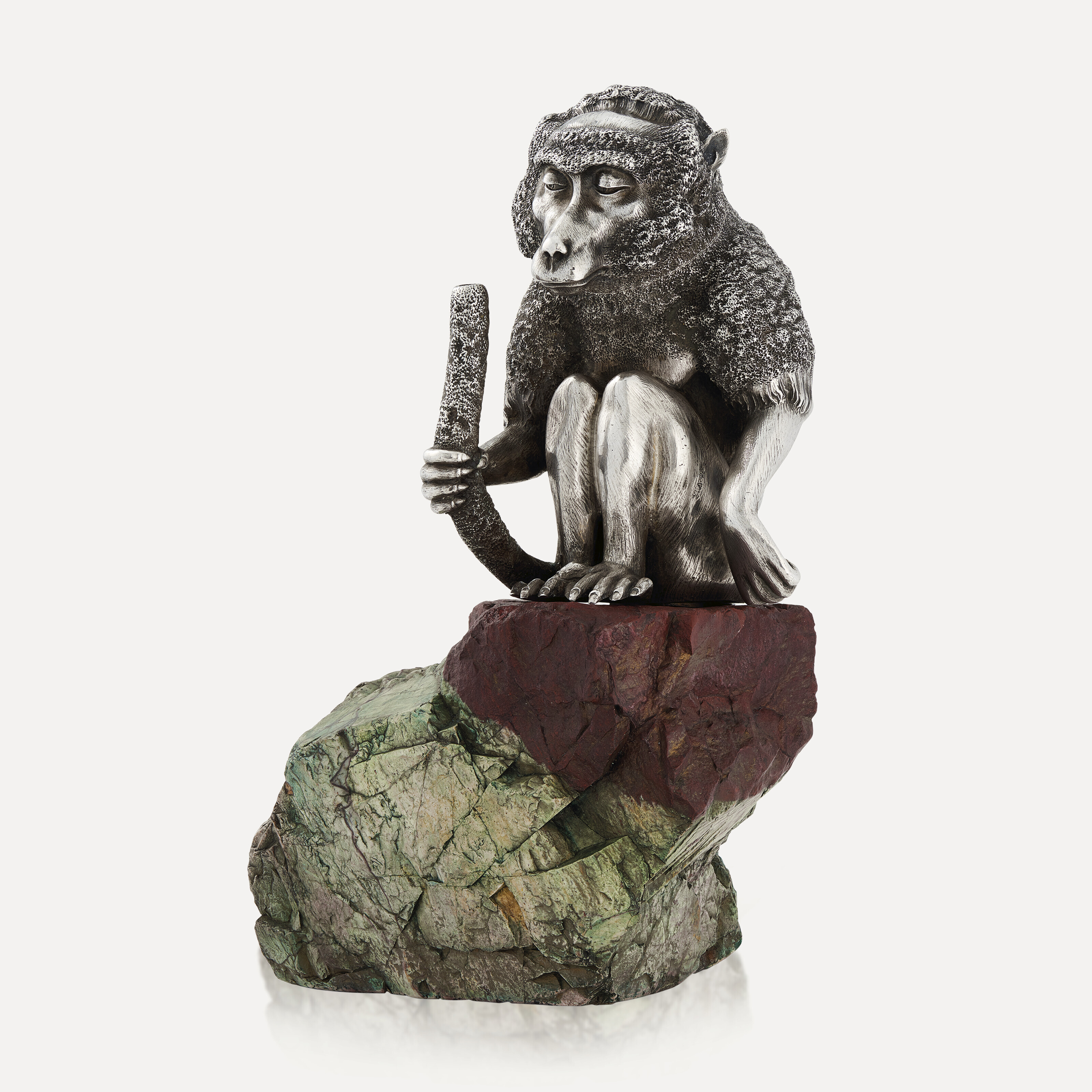 A SILVER TABLE LIGHTER IN THE FORM OF A SEATED BABOON, BY FABERGÉ, MARK ...