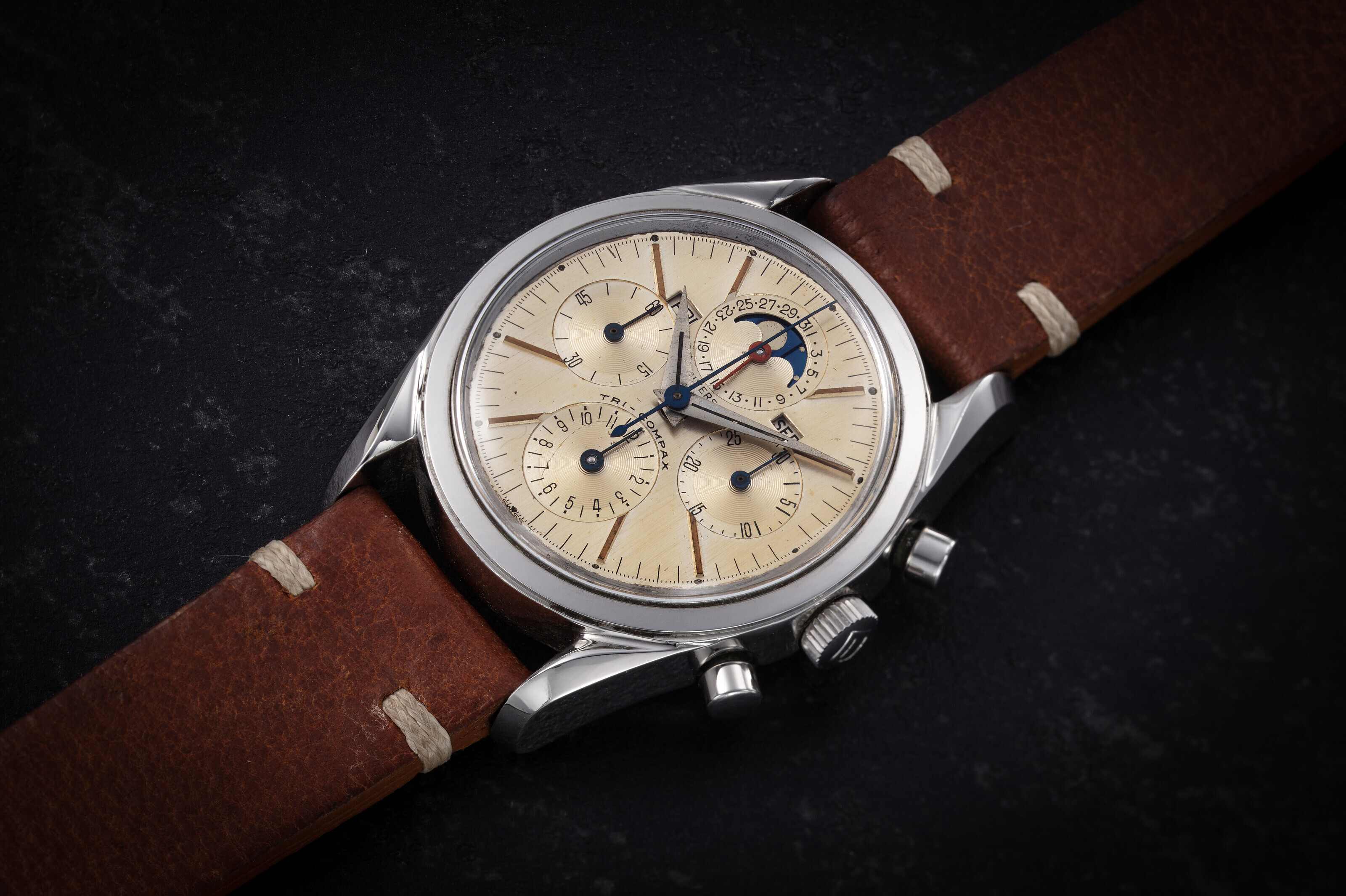 UNIVERSAL GENEVE, TRICOMPAX, AN ATTRACTIVE STEEL TRIPLE CALENDAR ...