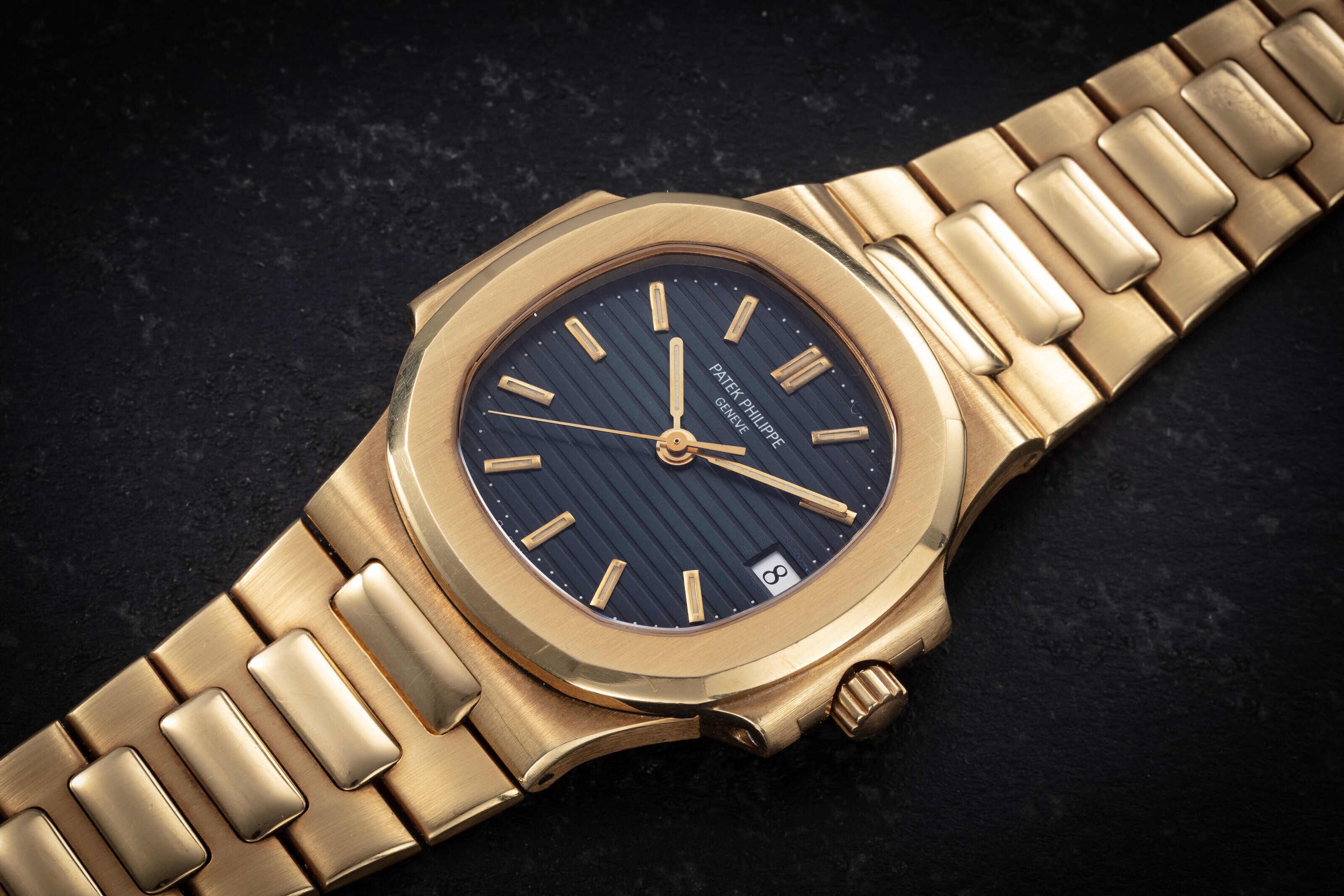 PATEK PHILIPPE, NAUTILUS REF. 3800/001J, A RARE AND ATTRACTIVE GOLD ...
