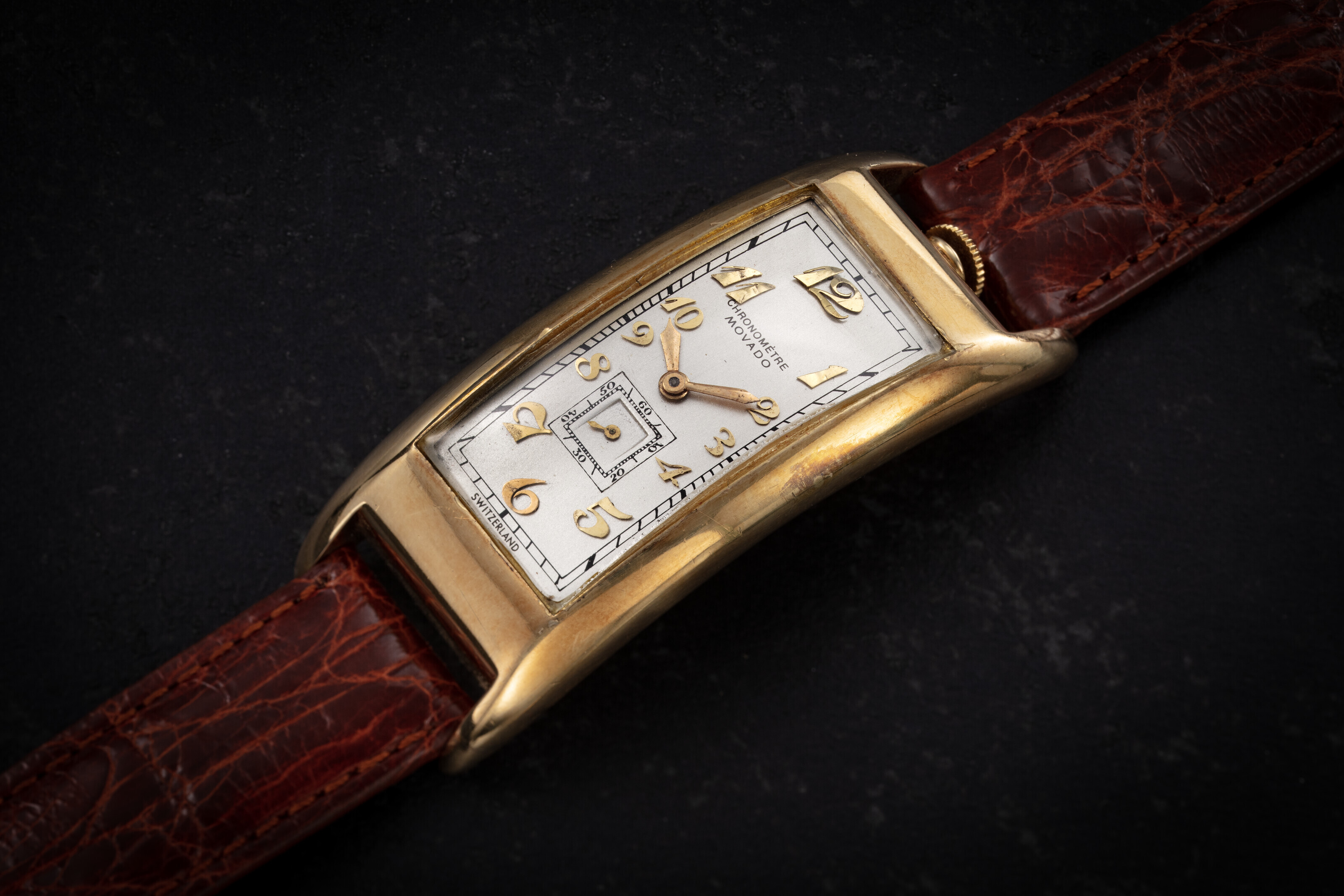 MOVADO, POLYPLAN MODEL REF. 44009, A RARE GOLD CURVED AND RECTANGULAR ...