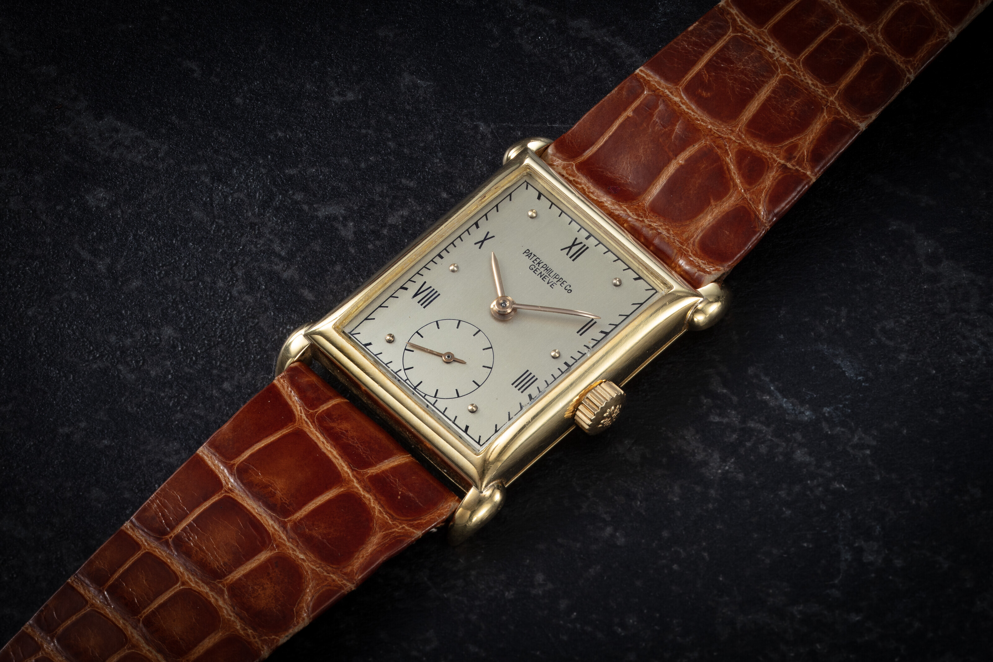 PATEK PHILIPPE, REF. 1530, A SHAPED YELLOW GOLD WRISTWATCH OF ROYAL ...