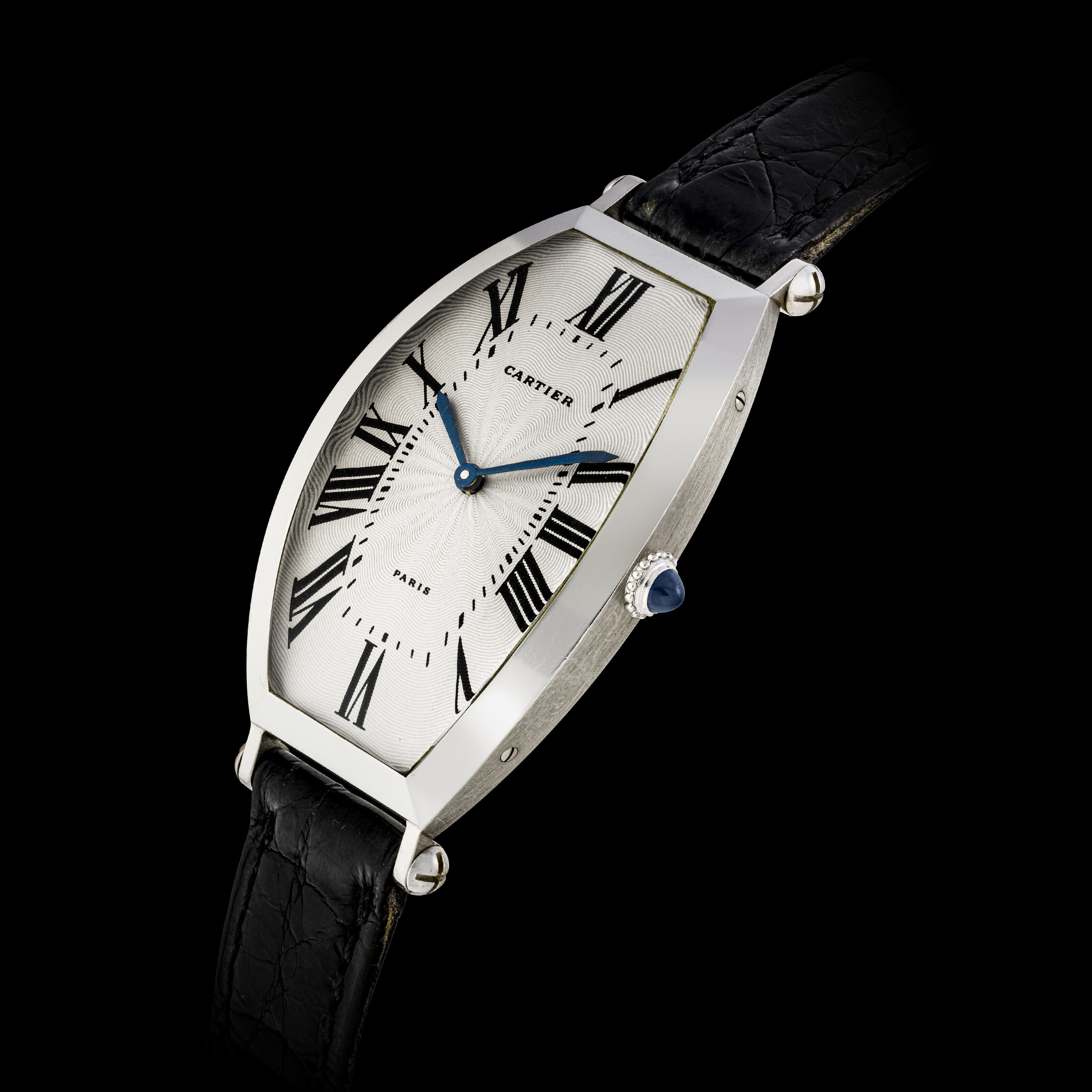 CARTIER, PLATINUM TONNEAU-SHAPED WRISTWATCH, | Christie’s