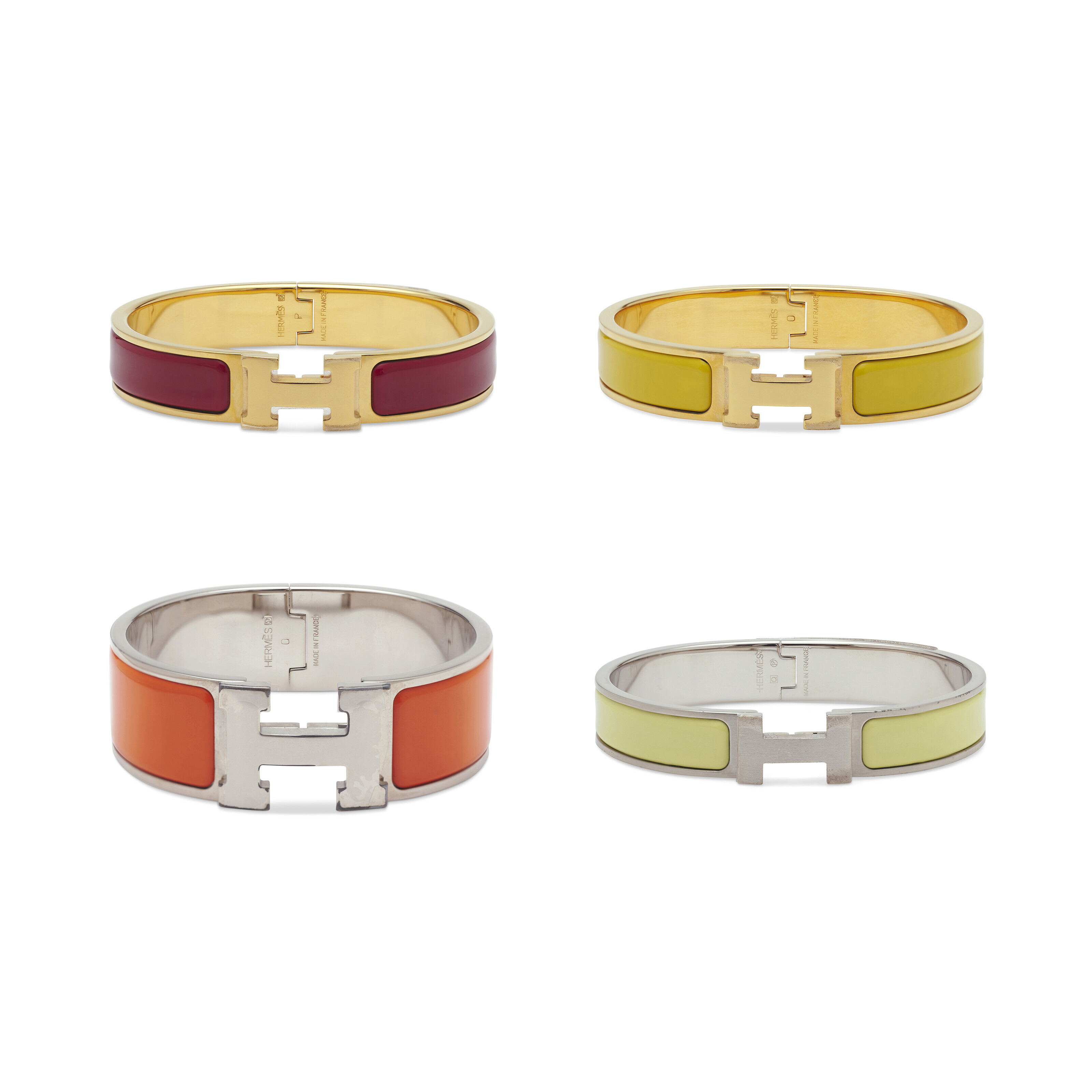 A SET OF FOUR: A RED CLIC H BRACELET WITH GOLD HARDWARE, A YELLOW CLIC ...