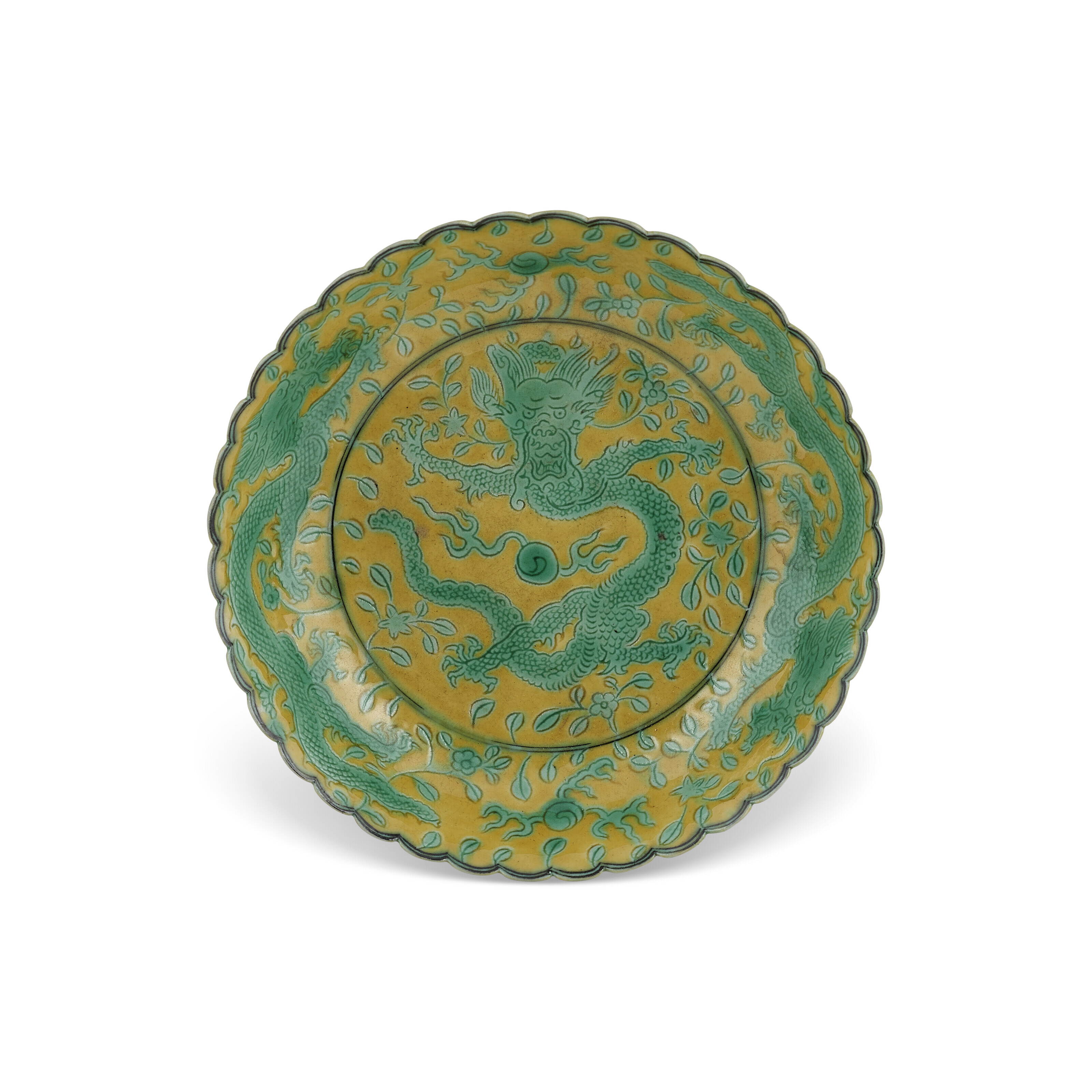 A SMALL YELLOW-GROUND AND GREEN-ENAMELLED FOLIATE-RIMMED 'DRAGON' DISH ...
