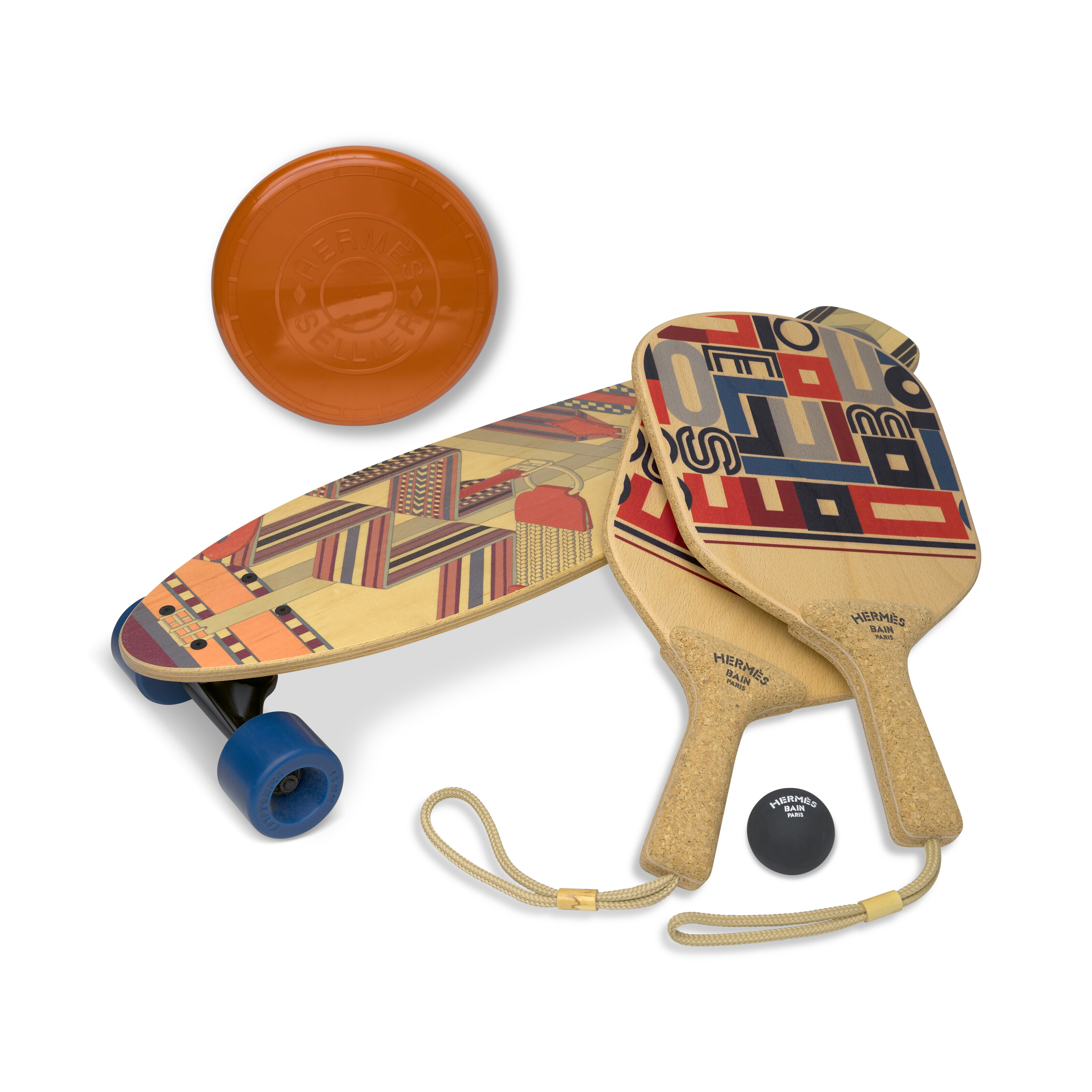 A SET OF THREE SPORTS OBJECTS: A WOUF FLYING DISC, A MAPLE SKATEBOARD ...