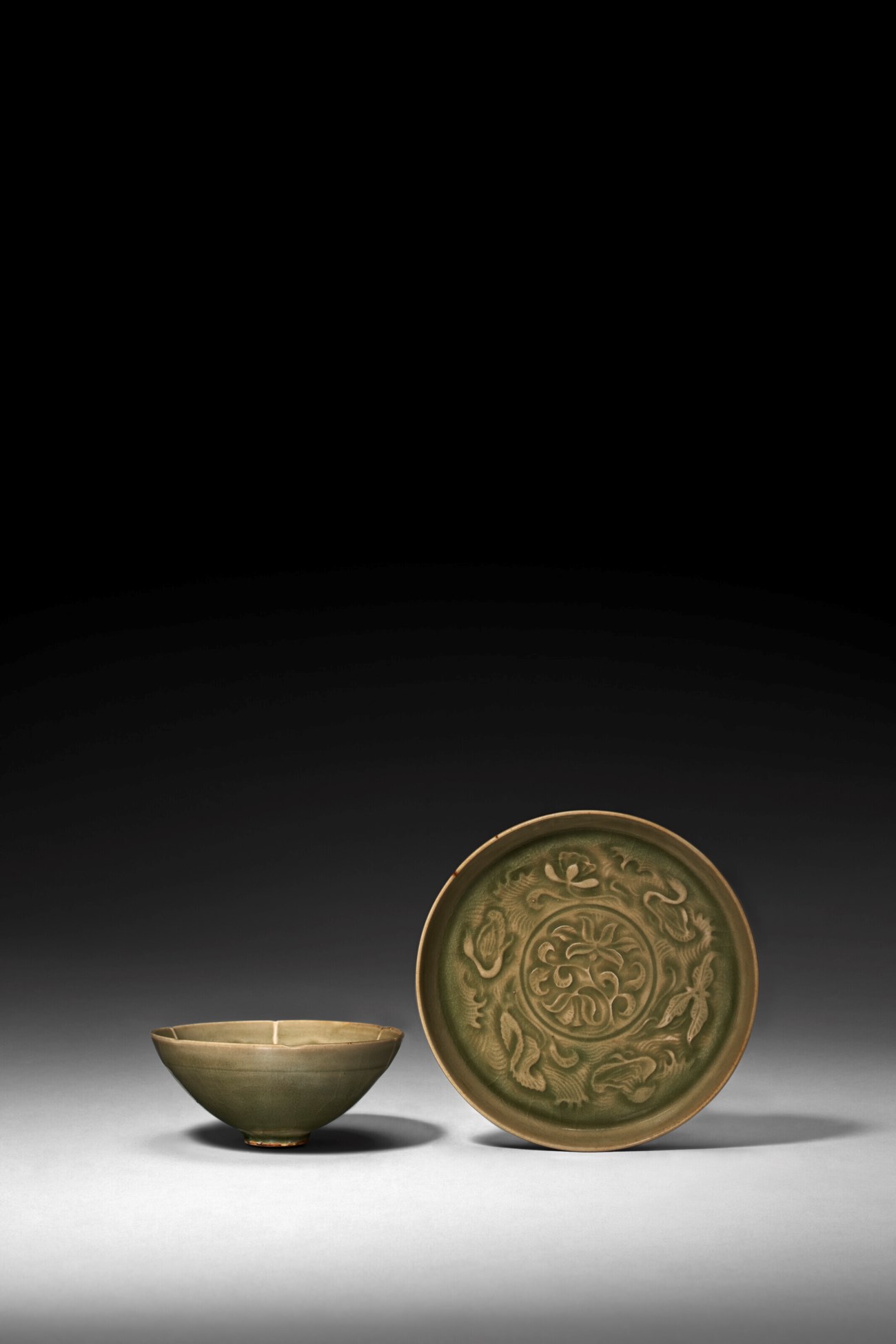 A MOLDED YAOZHOU CELADON `DUCK AND LOTUS’ BOWL AND A SAUCER, NORTHERN ...