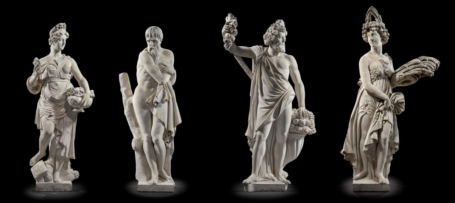 A GROUP OF FOUR OVER-LIFESIZE MARBLE FIGURES OF THE FOUR SEASONS