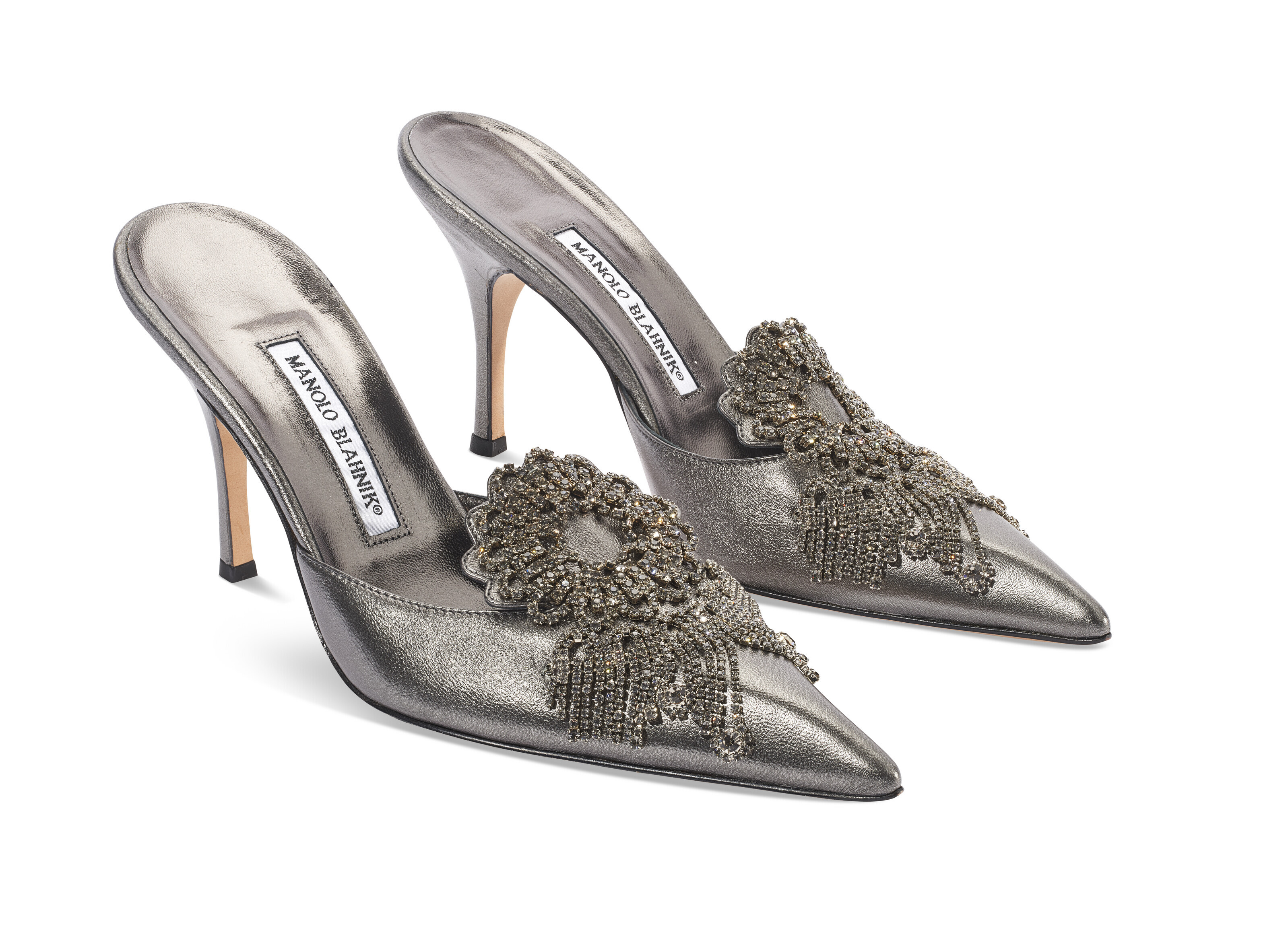 A PAIR OF RHINESTONE-APPLIED SILVER LEATHER MULES, MANOLO BLAHNIK ...