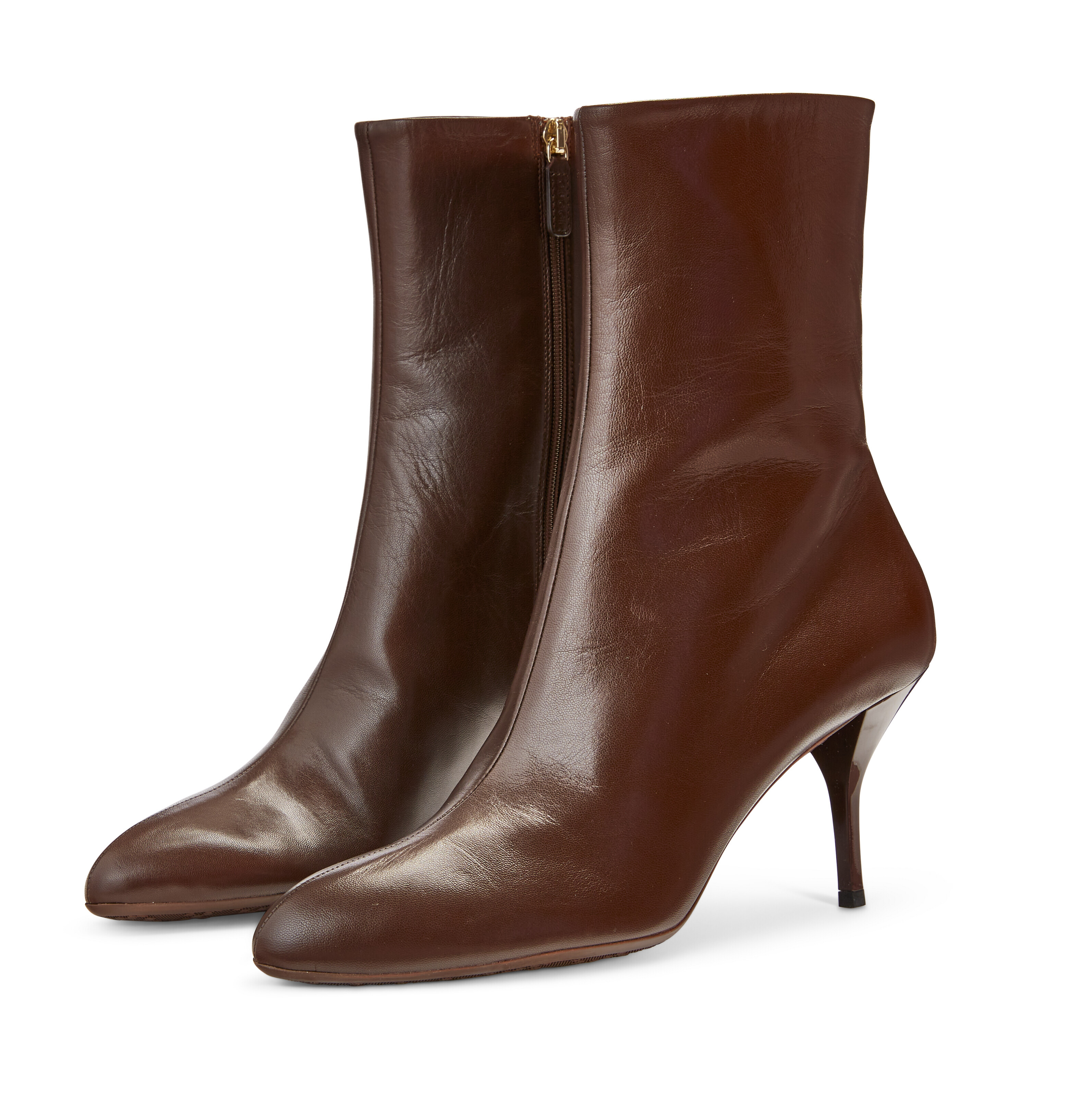 A PAIR OF BROWN LEATHER HEELED ANKLE BOOTS, GUCCI, CIRCA 2009 | Christie’s