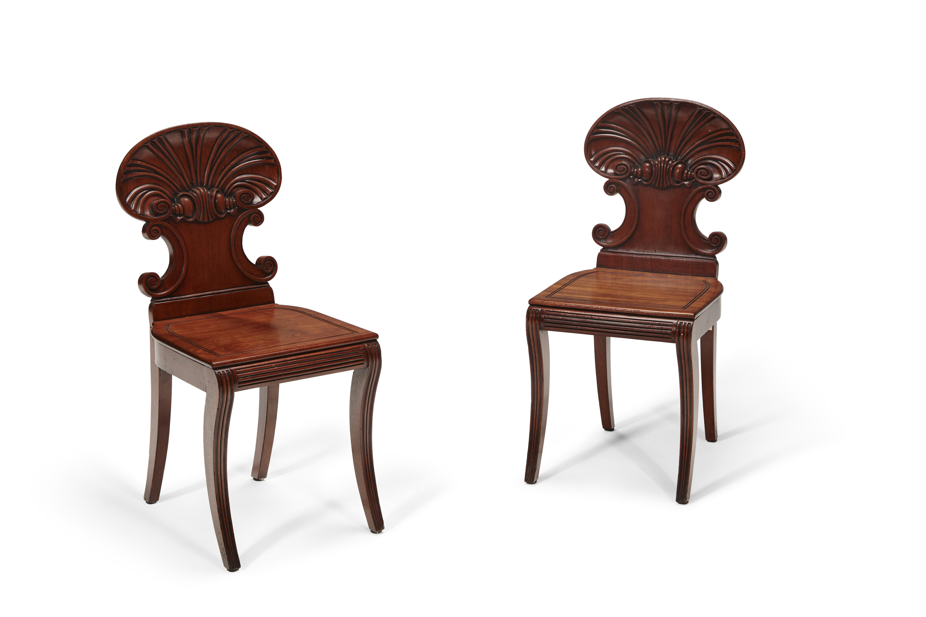 A PAIR OF REGENCY MAHOGANY HALL CHAIRS, ATTRIBUTED TO GILLOWS, CIRCA ...
