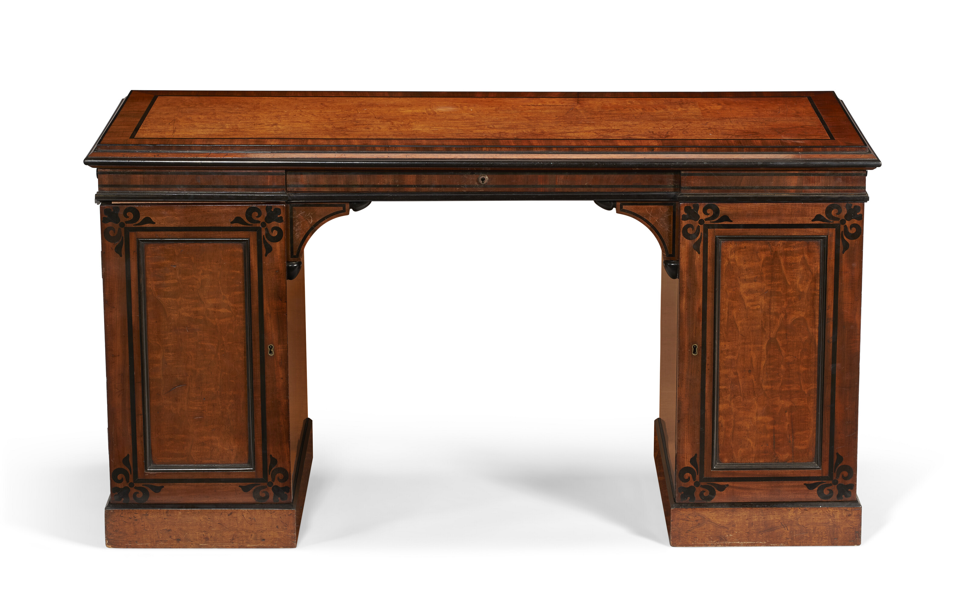 A REGENCY FIGURED MAHOGANY AND EBONY-INLAID PEDESTAL LIBRARY TABLE ...