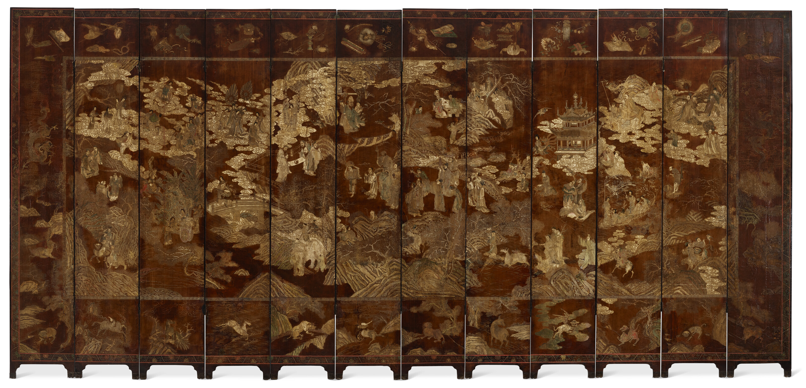 A CHINESE TWELVE-PANEL BROWN AND POLYCHROME COROMANDEL LACQUER SCREEN ...