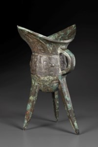 A RARE BRONZE RITUAL TRIPOD WINE VESSEL, JIAO, LATE SHANG DYNASTY, 12TH ...