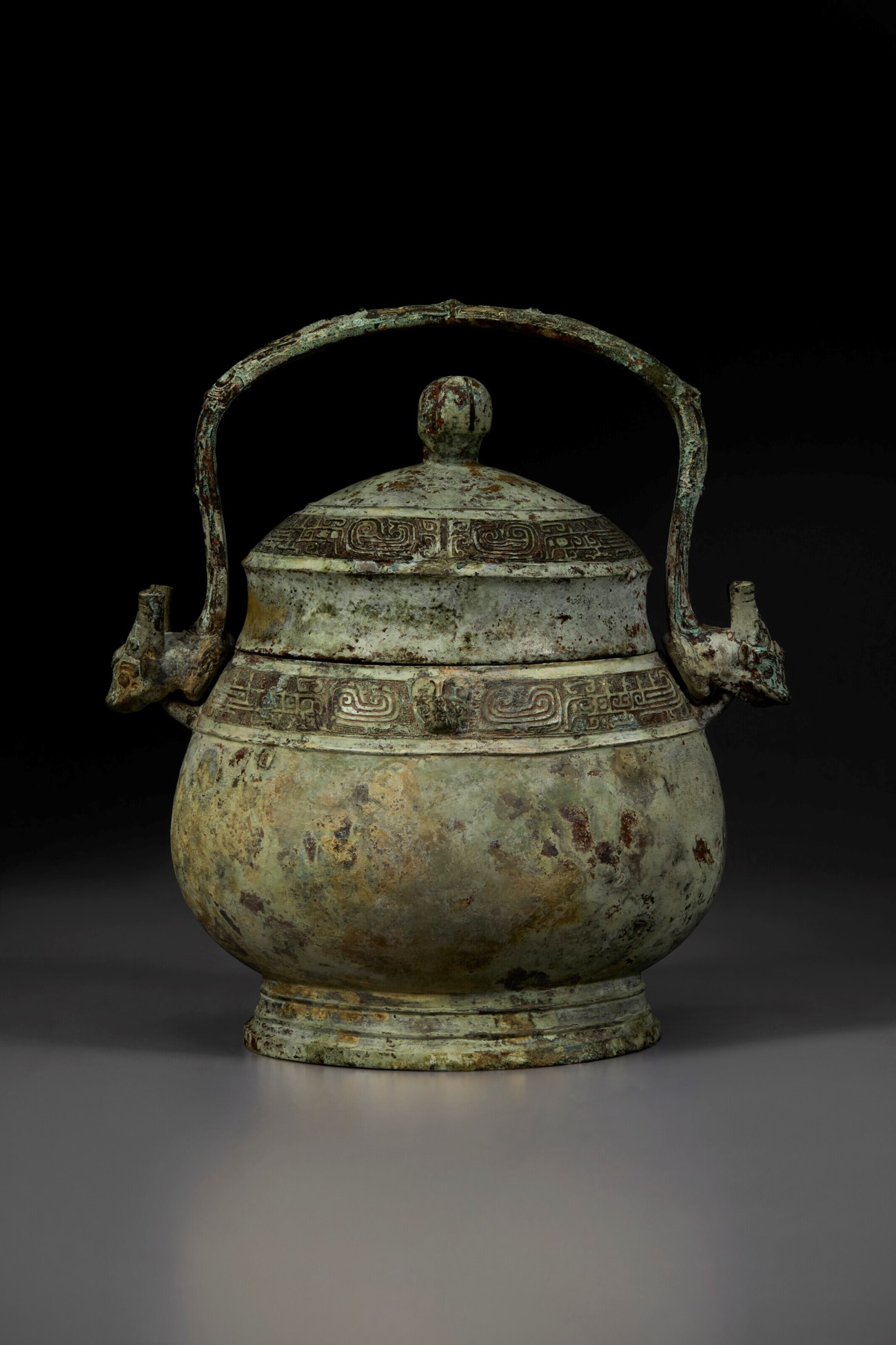 A BRONZE RITUAL WINE VESSEL AND COVER, YOU, LATE SHANG-EARLY WESTERN ...