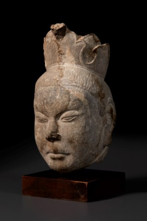A STONE HEAD OF A DEITY
