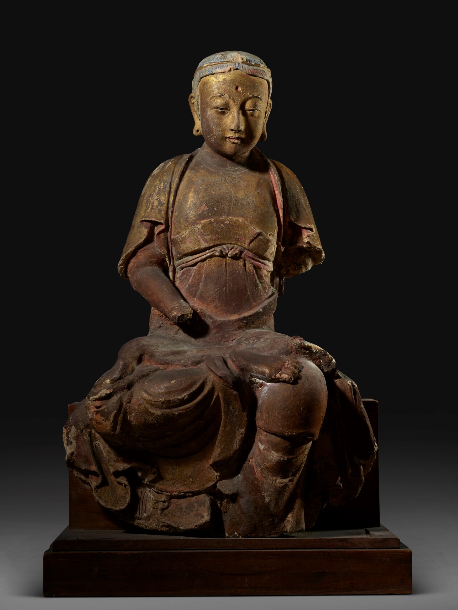 A RARE LARGE PAINTED AND GILT STUCCO FIGURE OF A SEATED BODHISATTVA ...