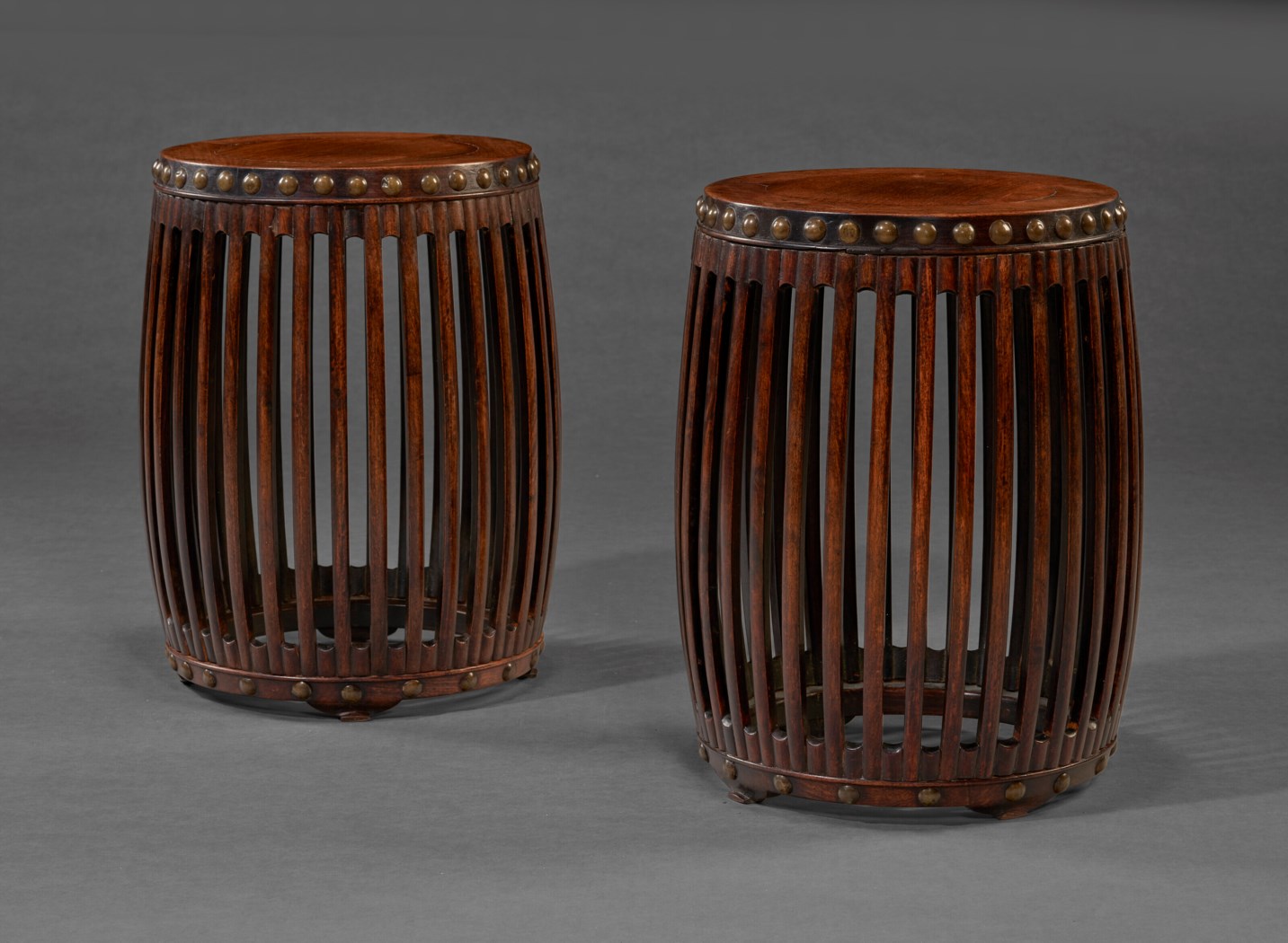 A RARE PAIR OF HUANGHUALI BARREL-FORM STOOLS, 17TH-18TH CENTURY ...
