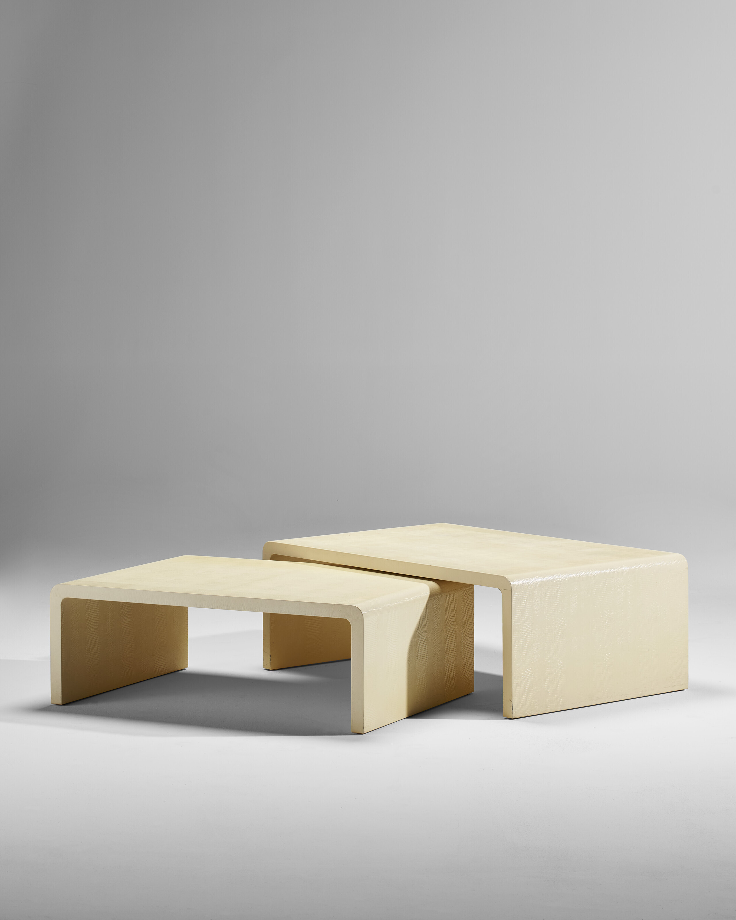 KARL SPRINGER (1931-1991), Two Nesting Tables, circa 1970 | Christie’s