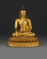 A LARGE GILT-BRONZE FIGURE OF AKSHOBHYA, TIBET, 15TH CENTURY | Christie's