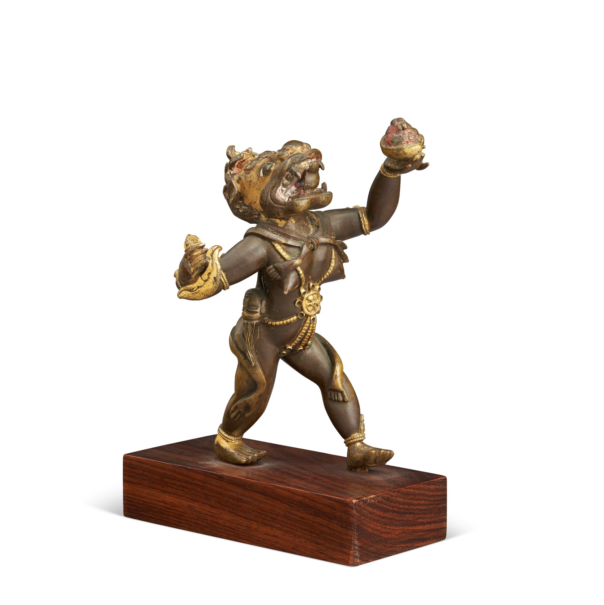 A PARCEL GILT BRONZE FIGURE OF SIMHAMUKHA, TIBETO-CHINESE, 18TH CENTURY ...