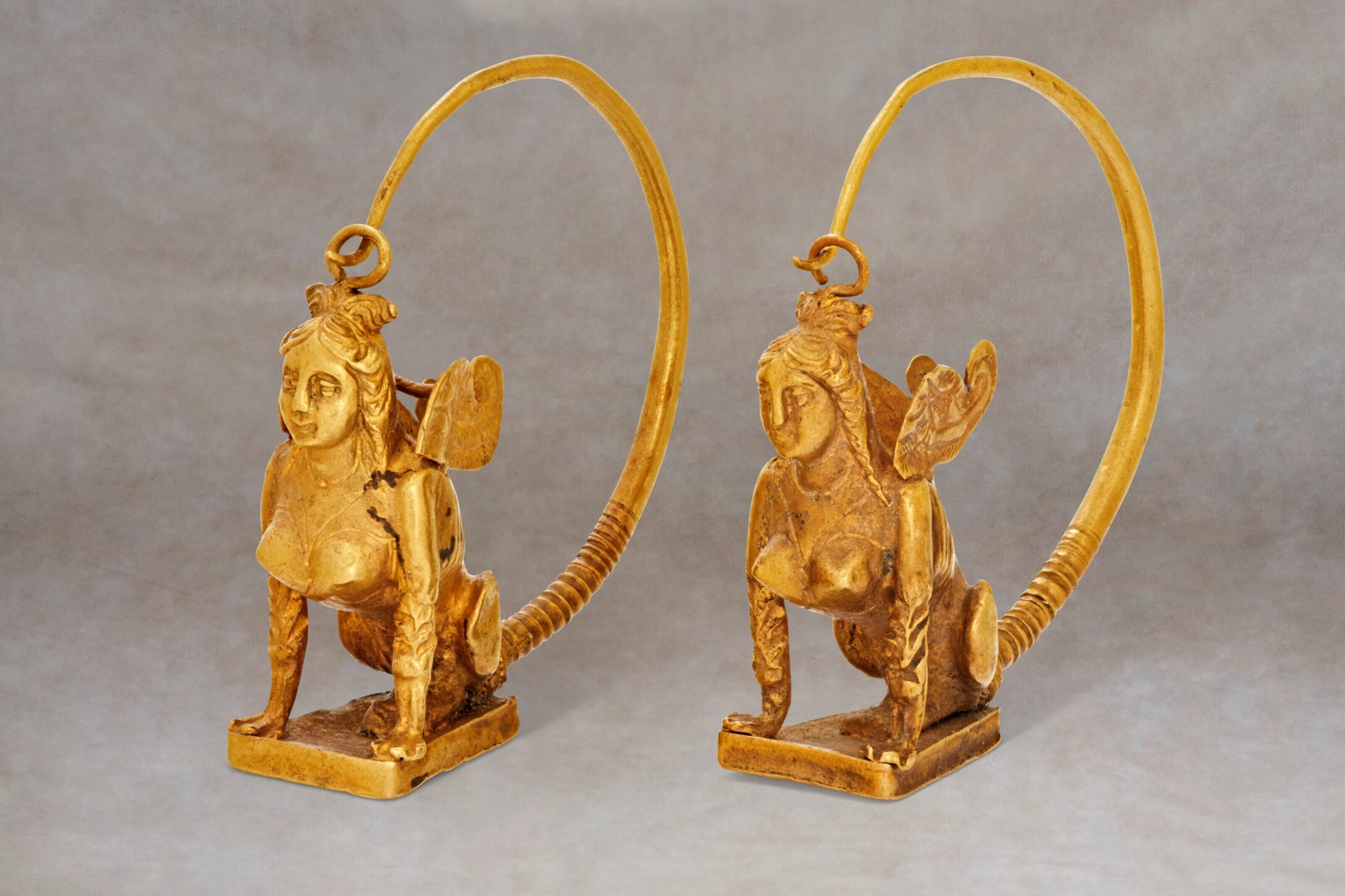 A PAIR OF GREEK GOLD SPHINX EARRINGS, HELLENISTIC PERIOD, CIRCA 3RD-2ND ...