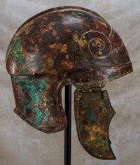A GREEK BRONZE CHALCIDIAN HELMET, LATE CLASSICAL TO EARLY HELLENISTIC ...