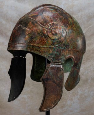 A GREEK BRONZE CHALCIDIAN HELMET, LATE CLASSICAL TO EARLY HELLENISTIC ...
