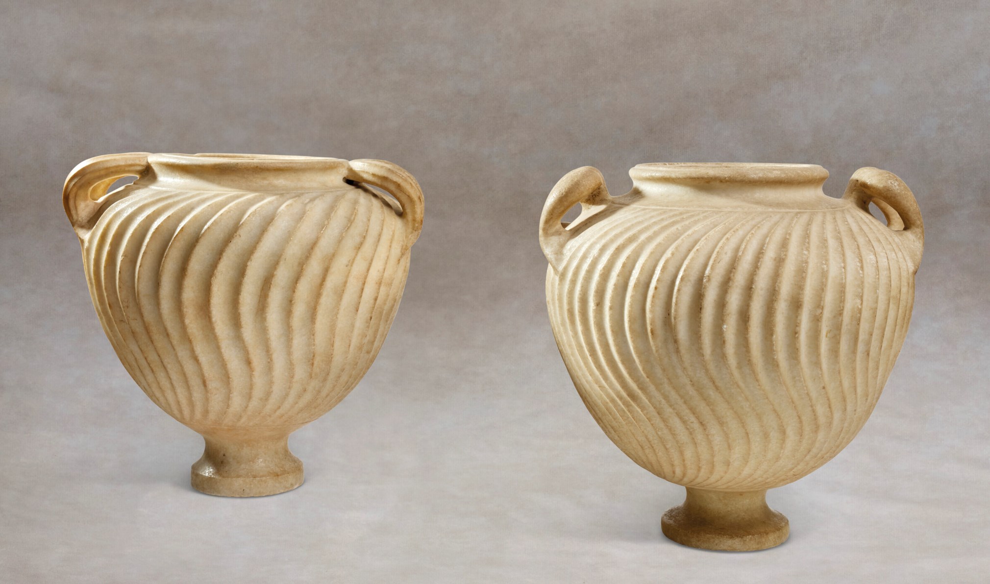 TWO ROMAN MARBLE STRIGILATED VASES, CIRCA 1ST-EARLY 2ND CENTURY A.D ...