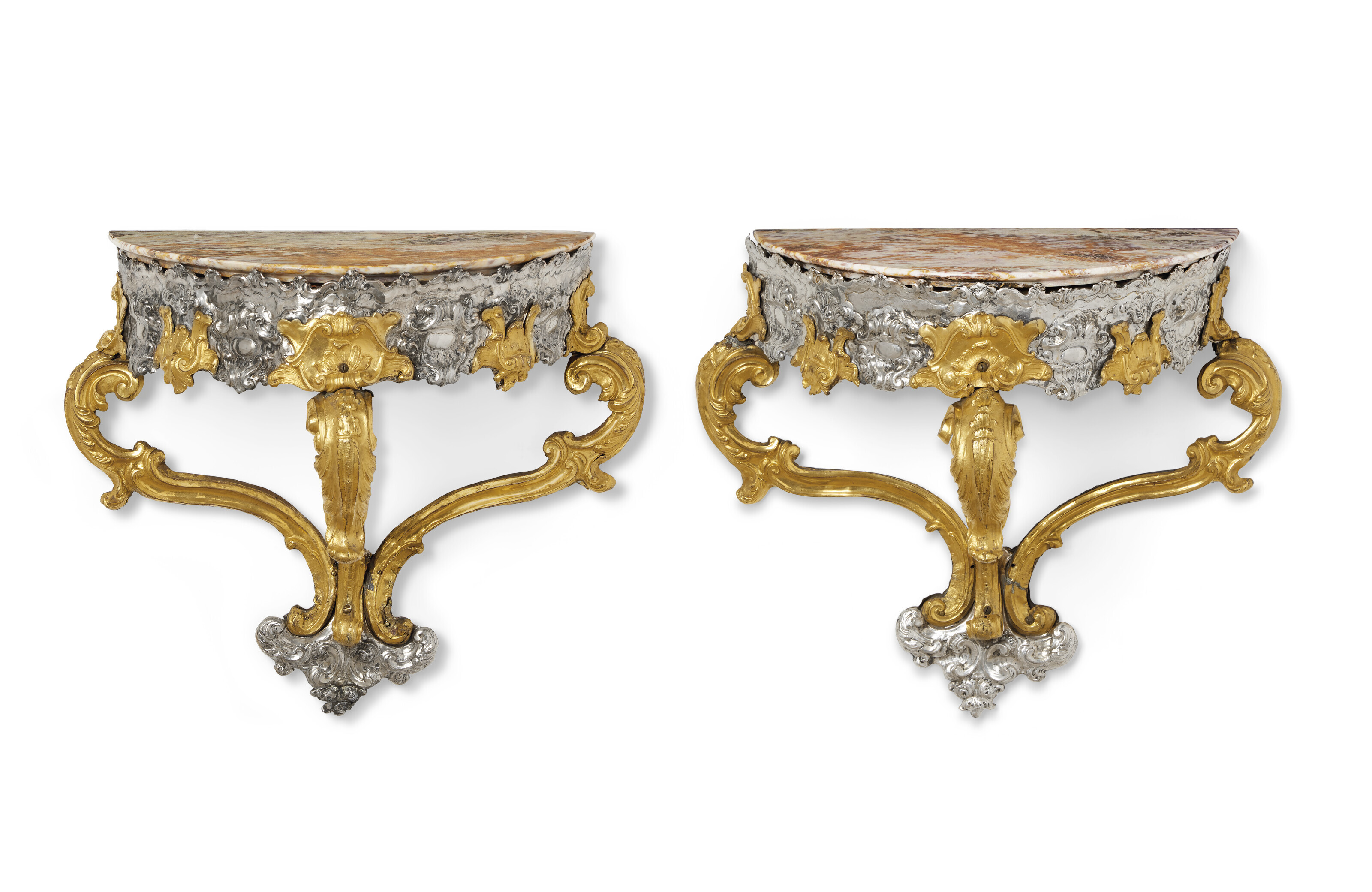 A PAIR OF SOUTH EUROPEAN SILVER AND GILT-COPPER HANGING CONSOLES ...