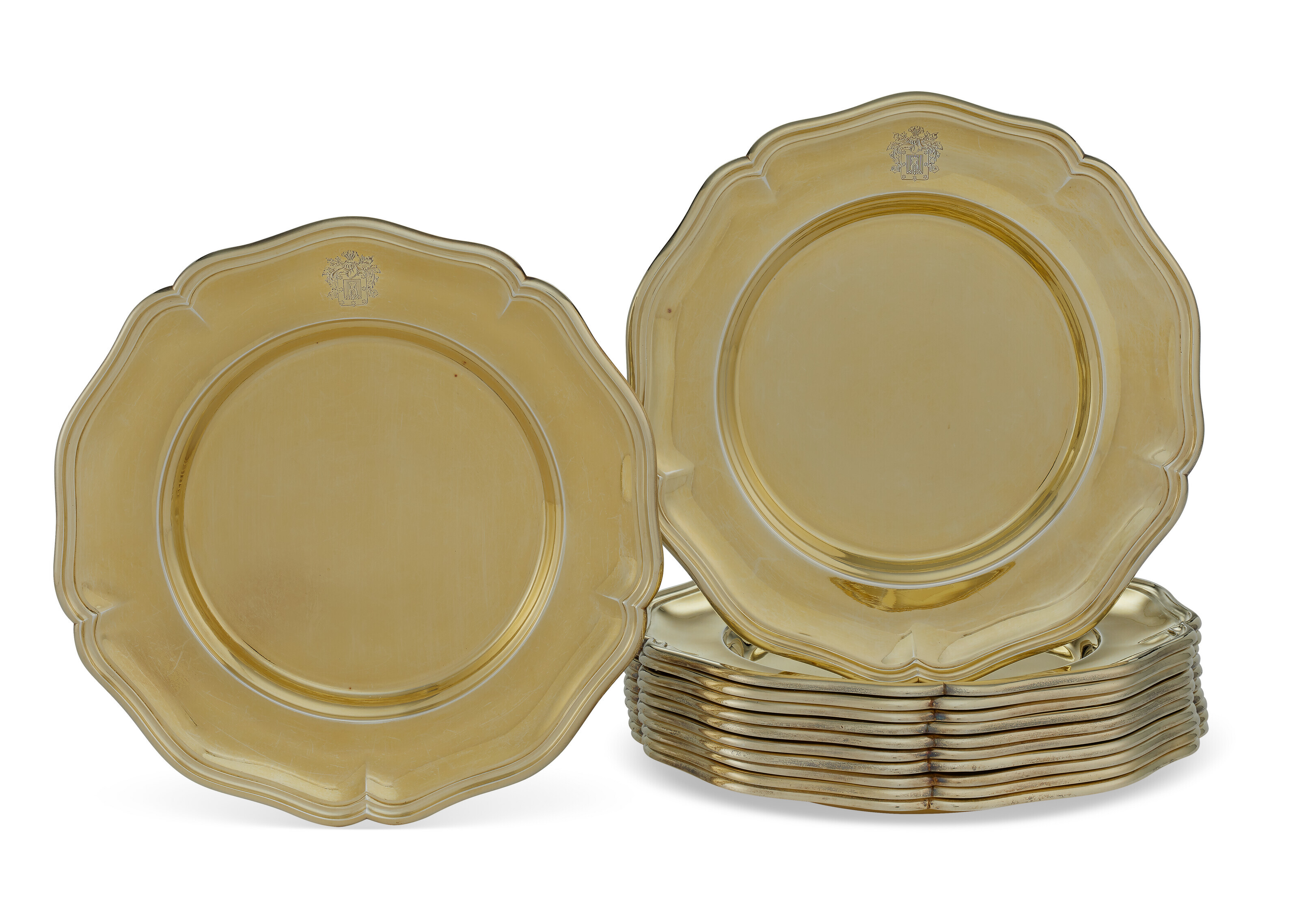 A SET OF TWELVE FRENCH SILVER-GILT DESSERT PLATES, MARK OF GUSTAVE ...