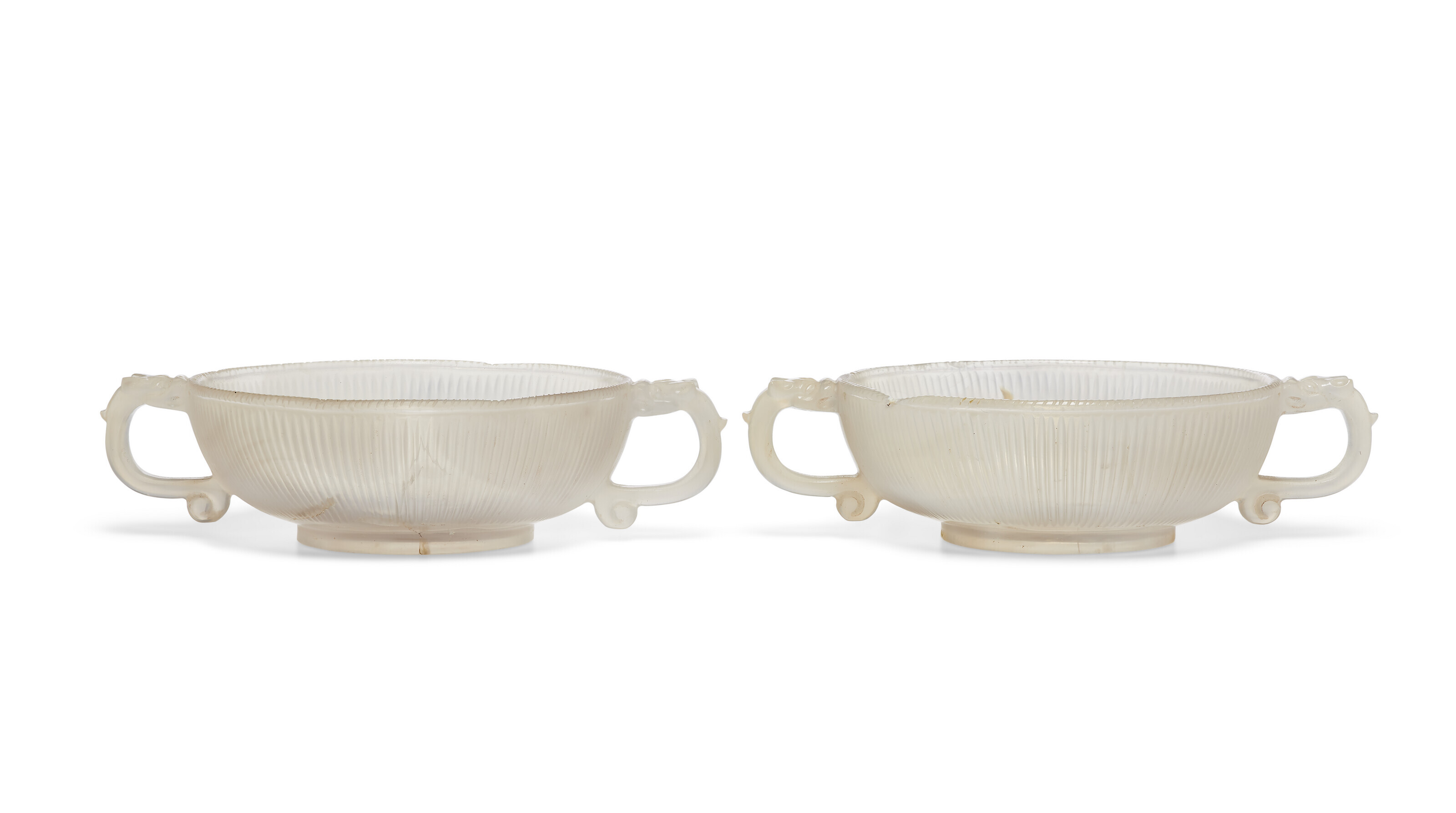 A PAIR OF AGATE CUPS WITH DRAGON-FORM HANDLES, CHINA, LATE QING DYNASTY ...