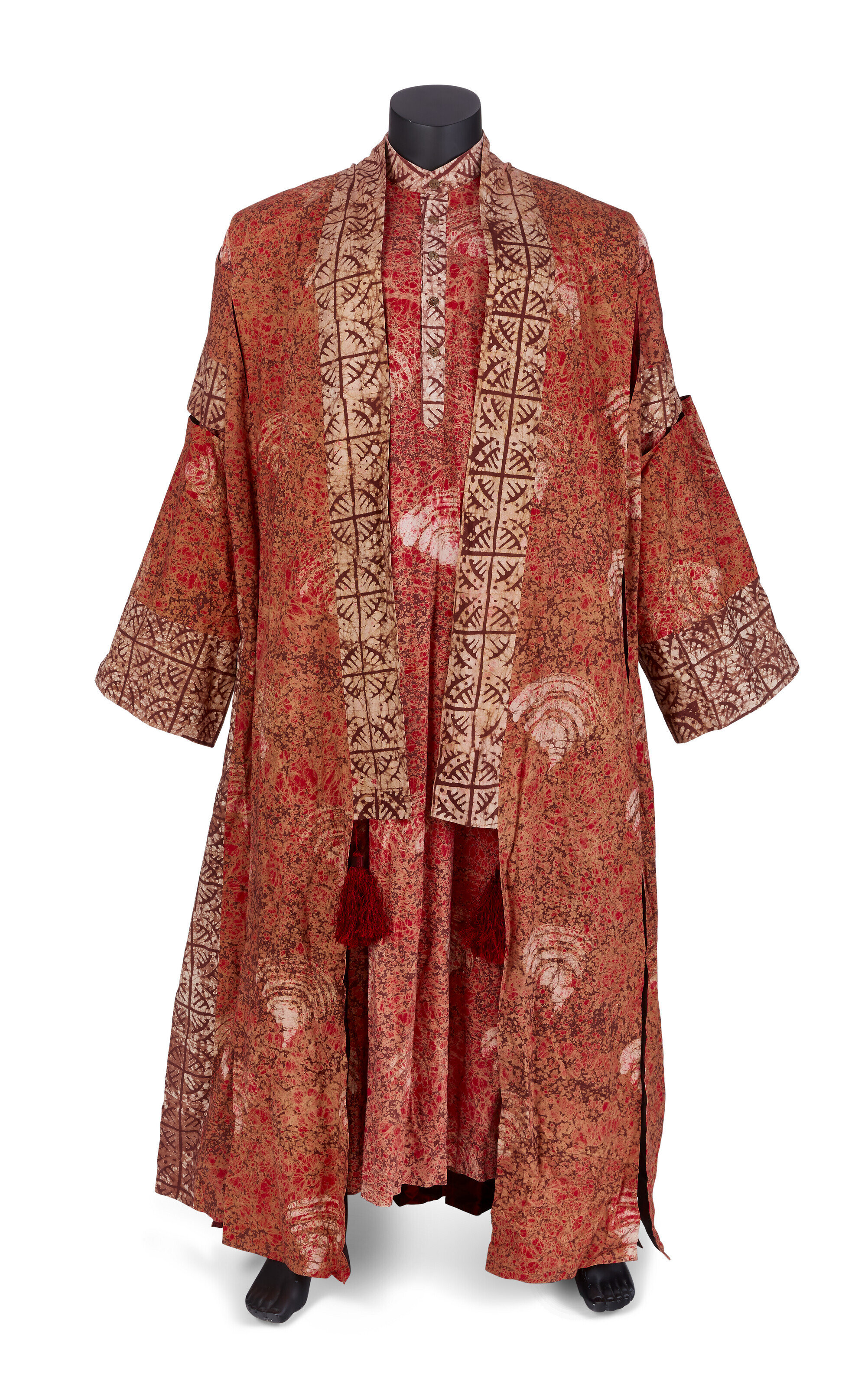 A COTTON POLYCHROME BATIK KIMONO AND UNDERLAYER TOGETHER WITH A BROWN ...