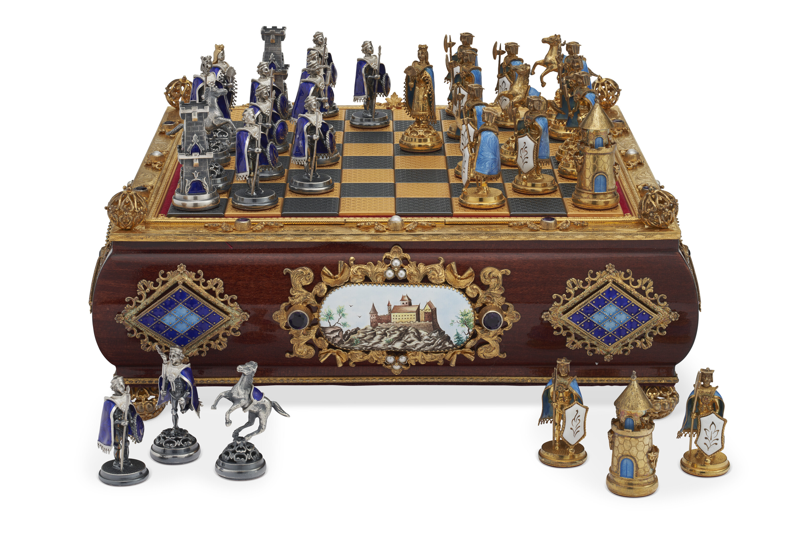 A CONTINENTAL SILVER-GILT AND ENAMEL-MOUNTED MAHOGANY CHESS SET AND ...