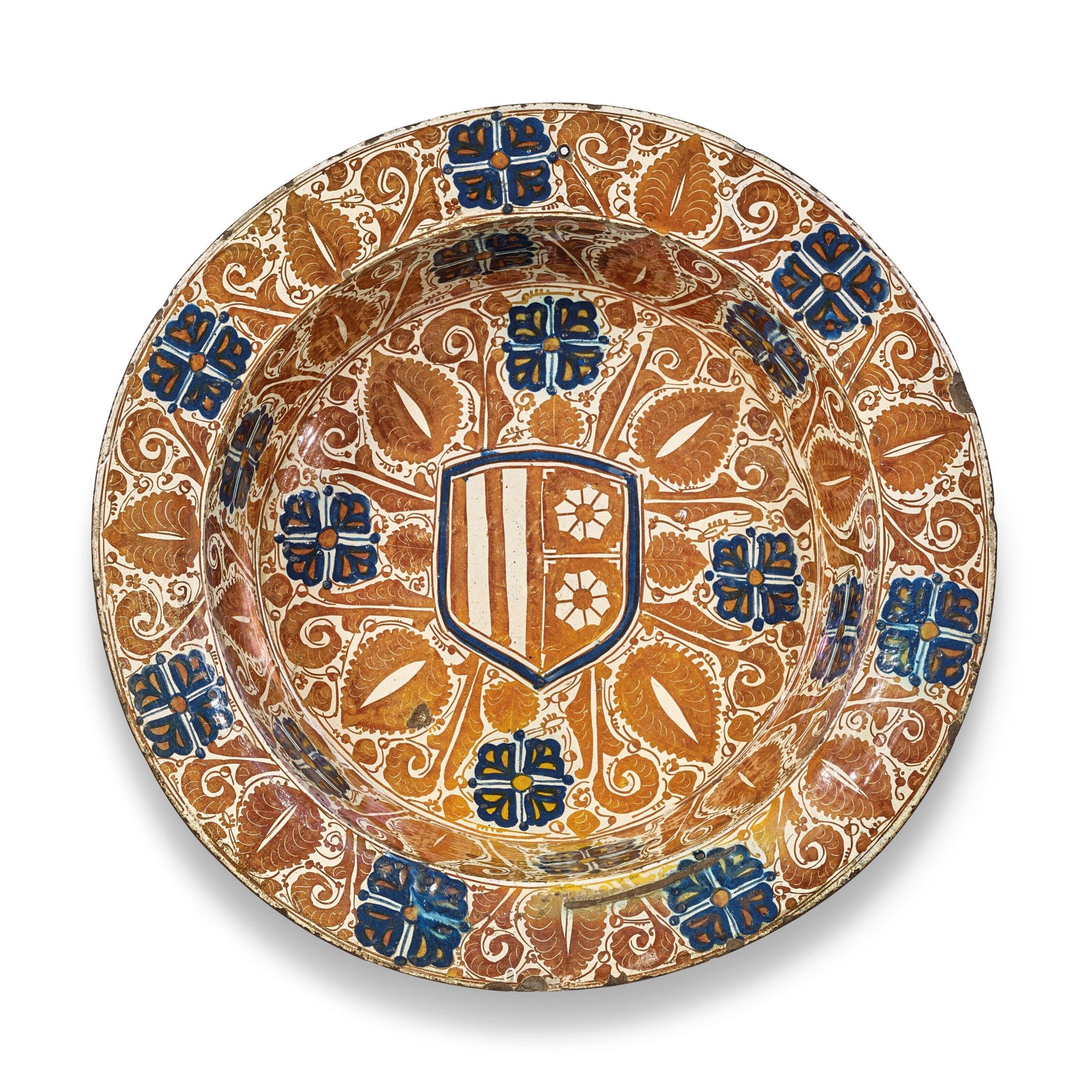 A LARGE HISPANO-MORESQUE EARTHENWARE BLUE AND GOLD-LUSTRED ARMORIAL ...