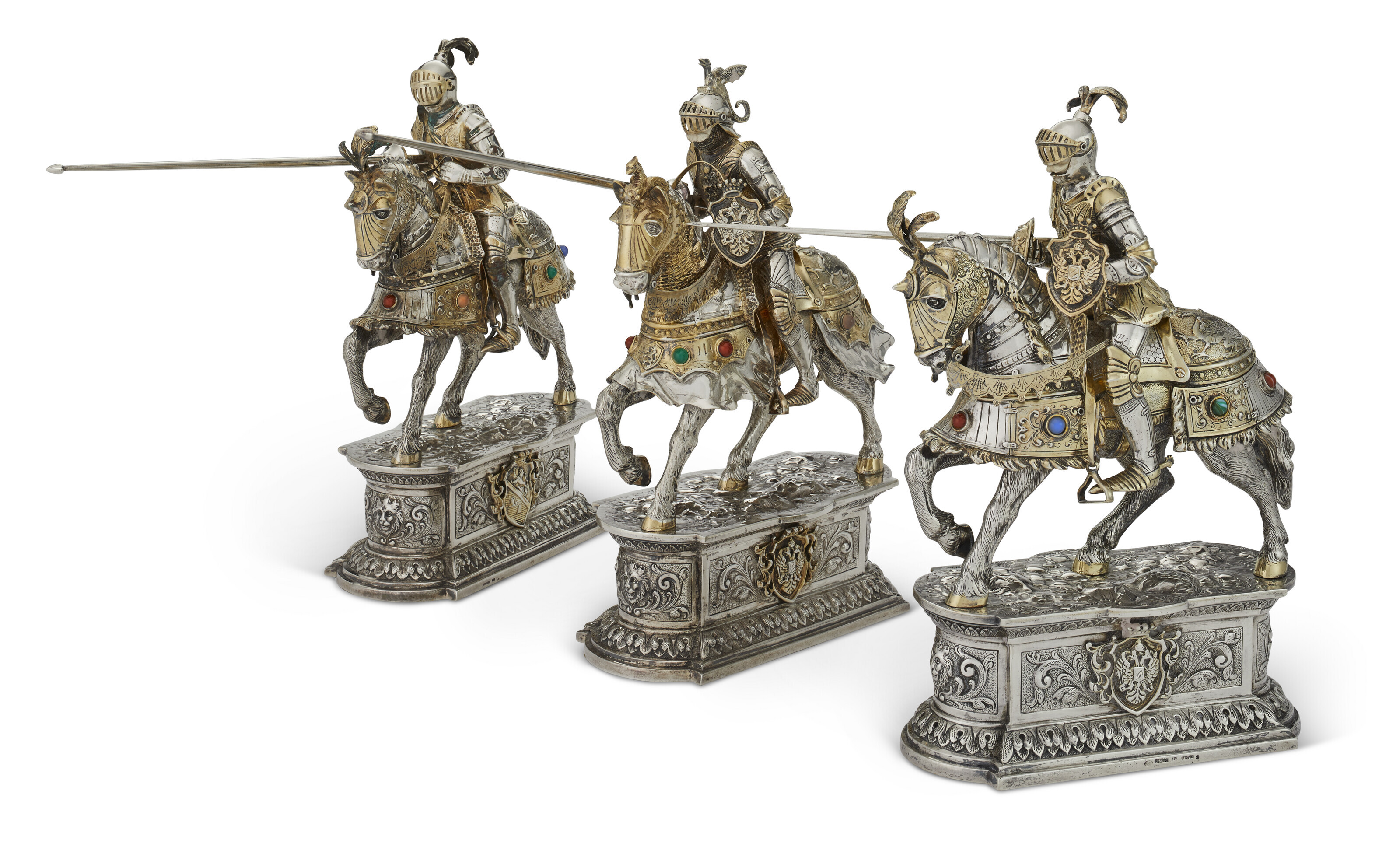 THREE GERMAN HARDSTONE-MOUNTED PARCEL-GILT SILVER FIGURES OF KNIGHTS ON ...