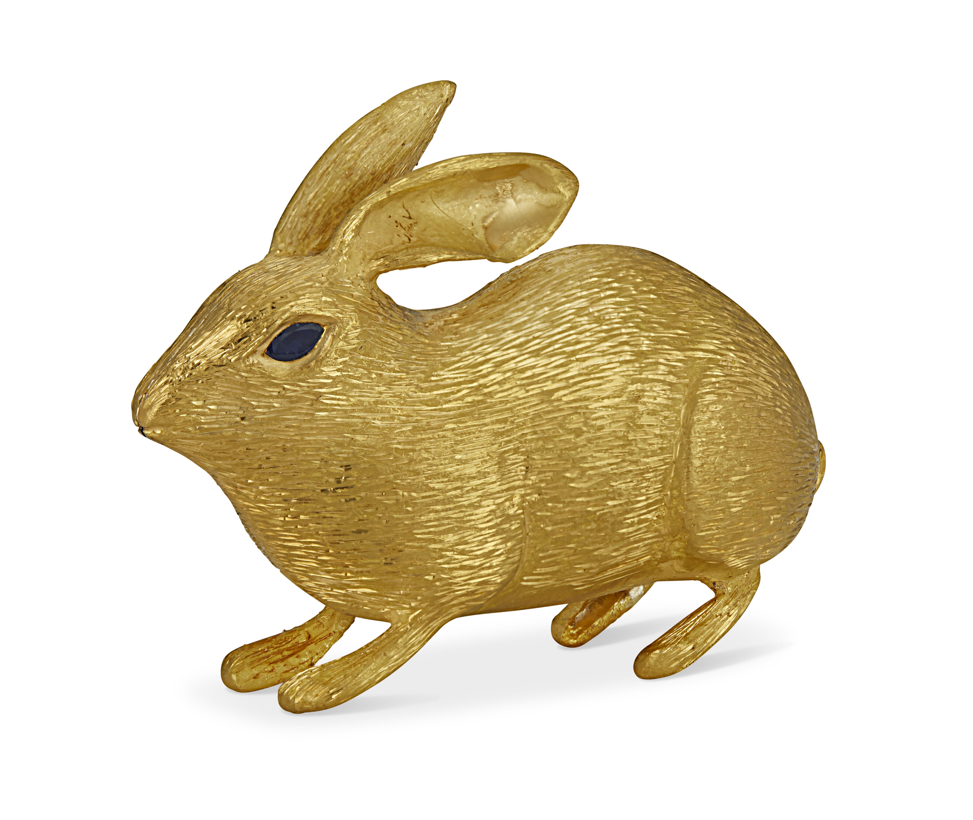 A SAPPHIRE-MOUNTED 24K GOLD FIGURE OF A RABBIT, SECOND HALF 20TH ...