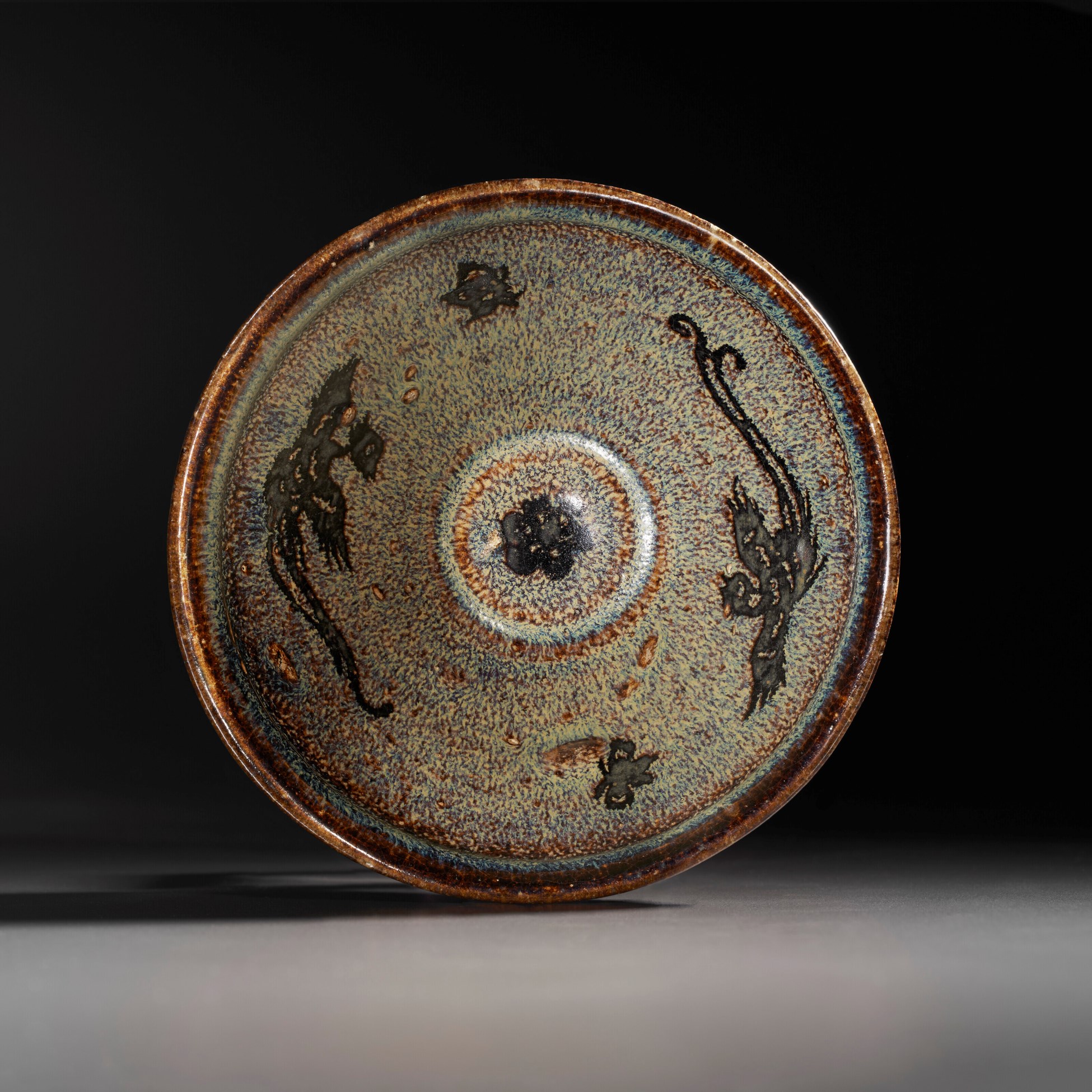 A SUPERB JIZHOU PAPER-CUT-DECORATED 'PHOENIX' TEA BOWL, SOUTHERN SONG ...