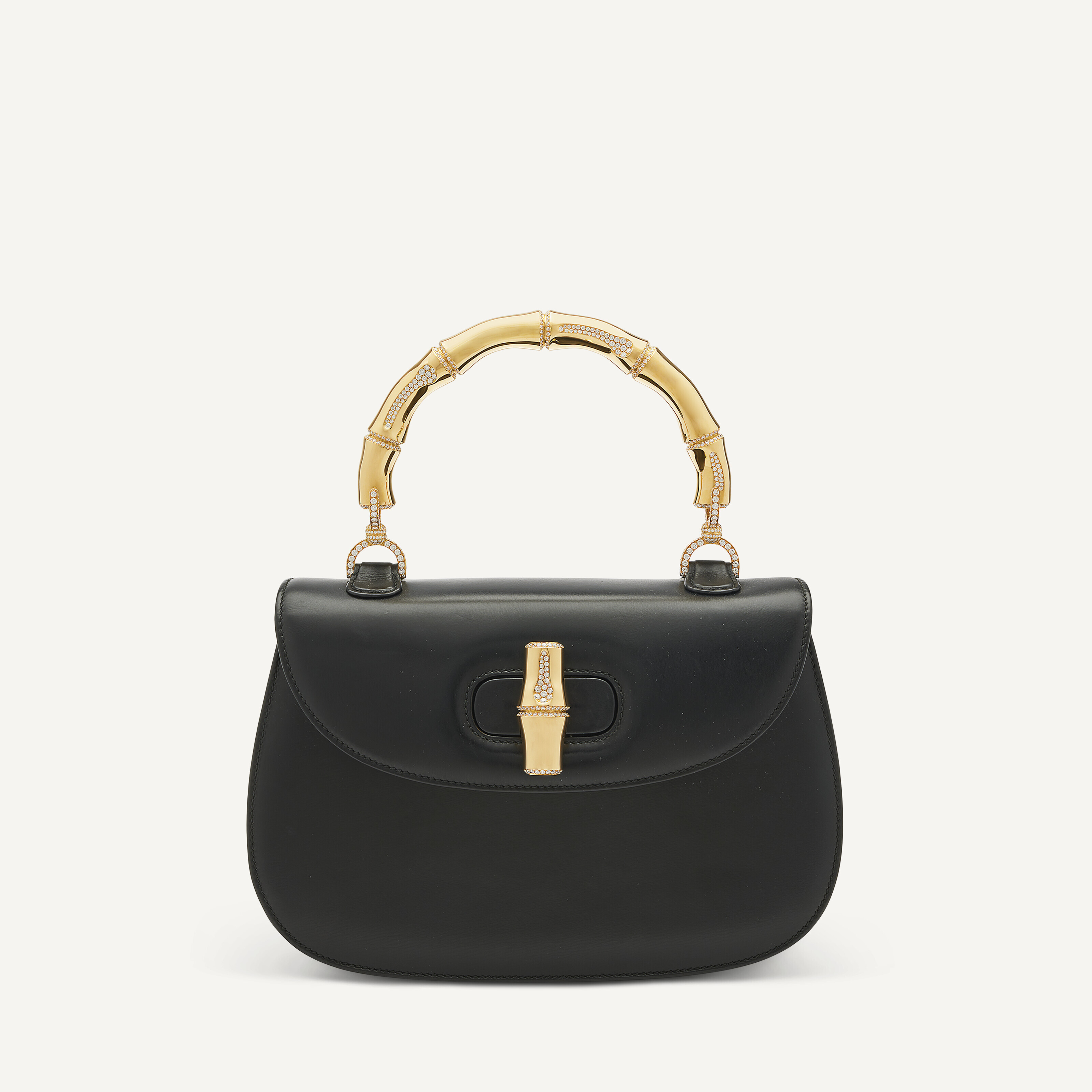 A UNIQUE BLACK LEATHER BAMBOO BAG WITH 18K YELLOW GOLD HANDLE & CLOSURE ...