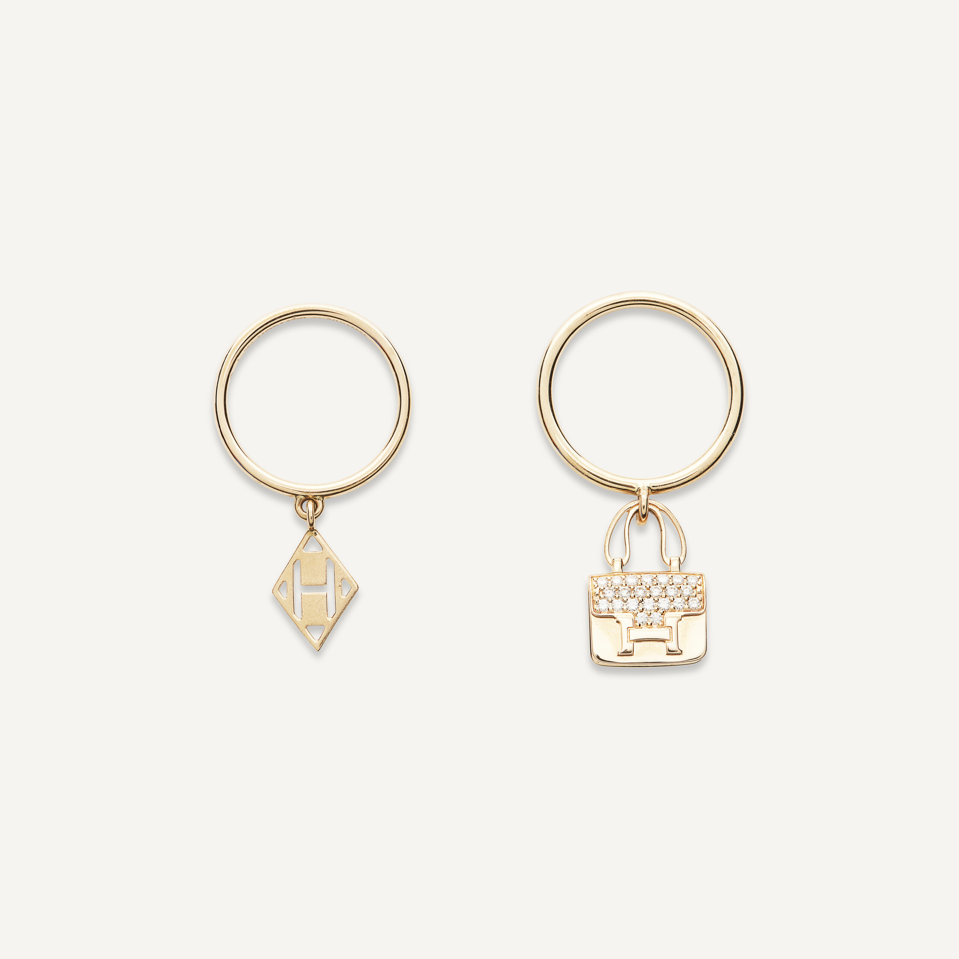 A GROUP OF TWO: AN 18K ROSE GOLD & DIAMOND AMULETTE CONSTANCE RING & AN 18K ROSE GOLD H GAMBADE ...