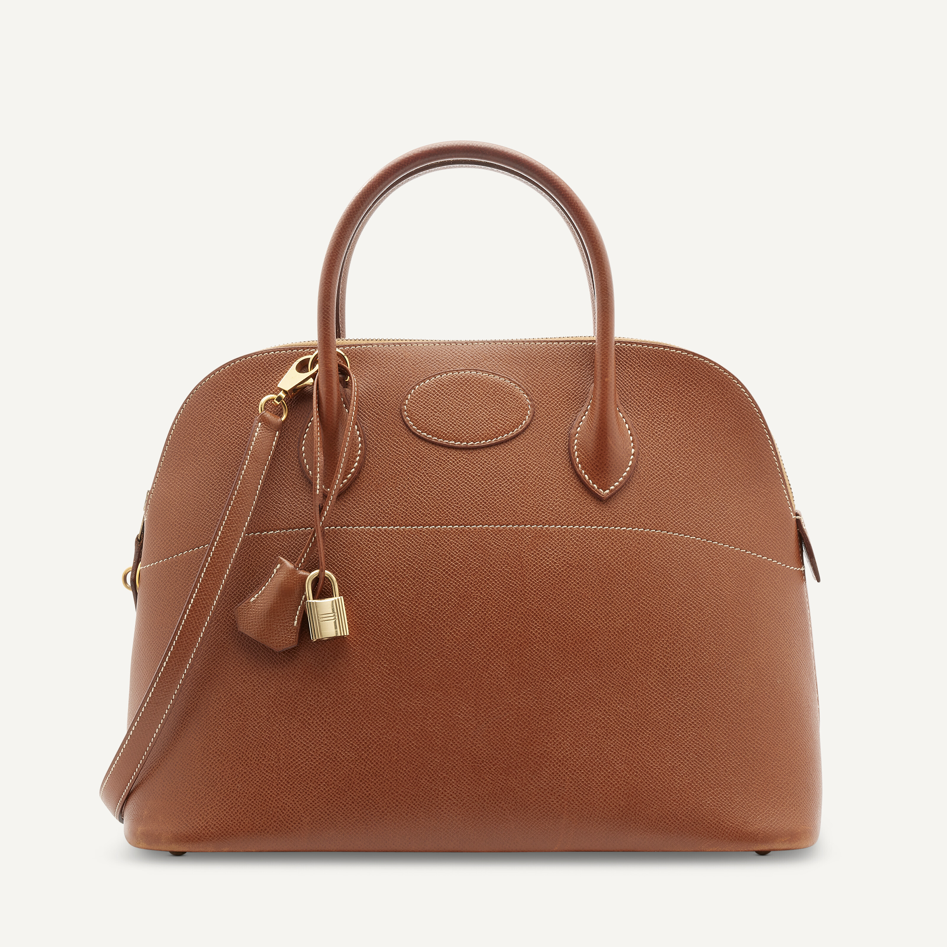 A GOLD COURCHEVEL LEATHER BOLIDE 35 WITH GOLD HARDWARE, HERMÈS, 1994 ...