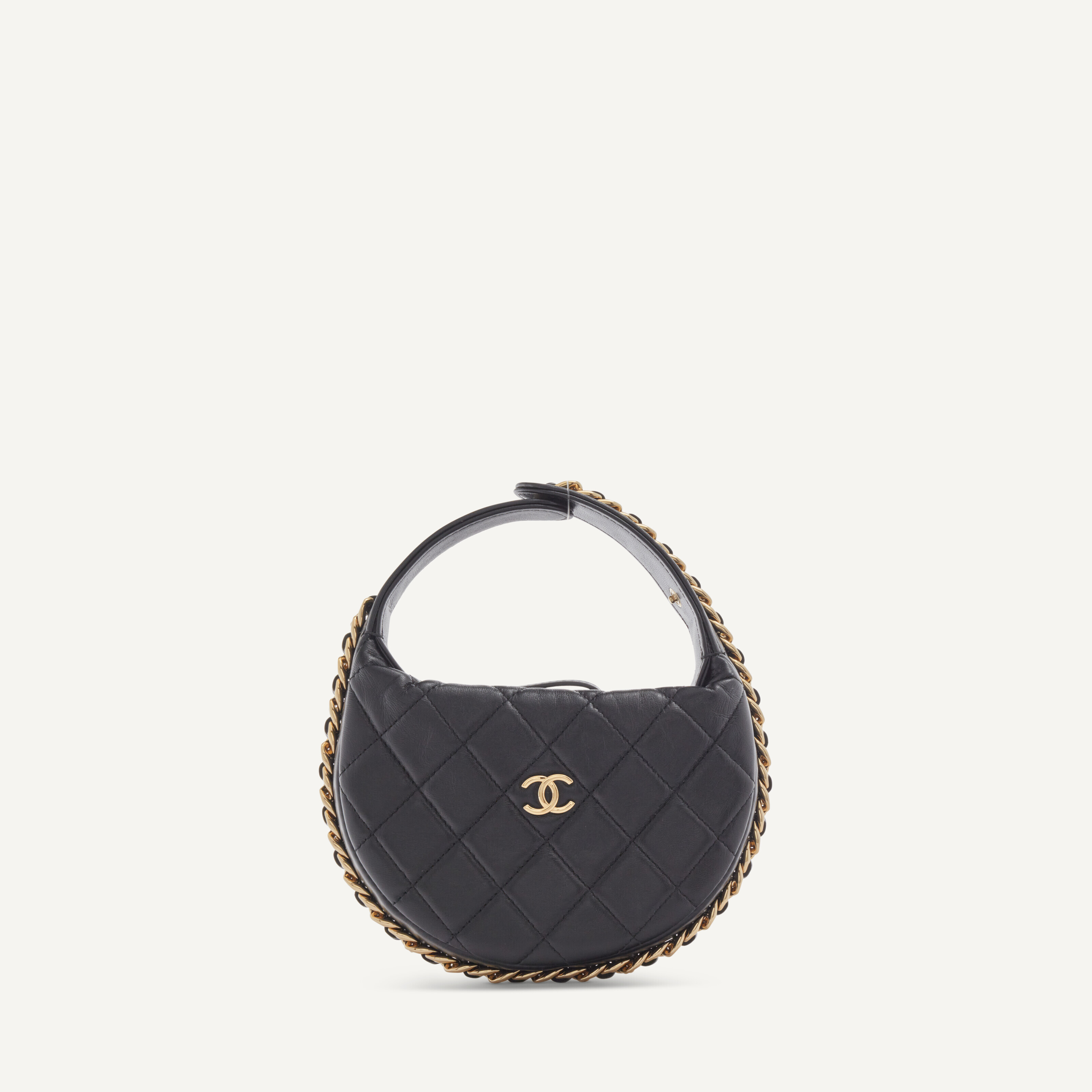 A BLACK QUILTED LAMBSKIN LEATHER ROUND MINI POUCH WITH LIGHT GOLD ...