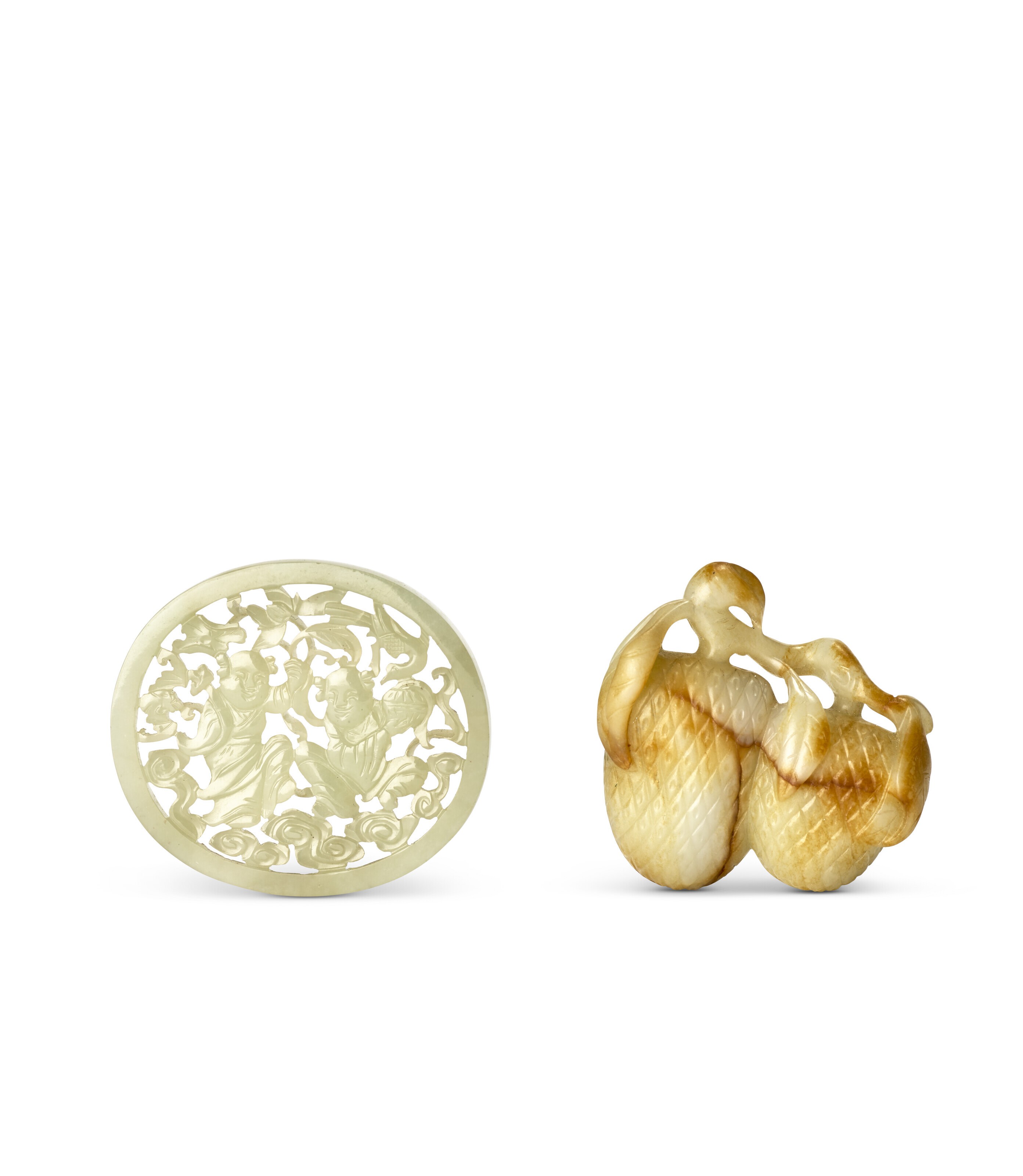 A WHITE AND RUSSET JADE CARVING OF LYCHEES AND A CELADON JADE OPENWORK ...