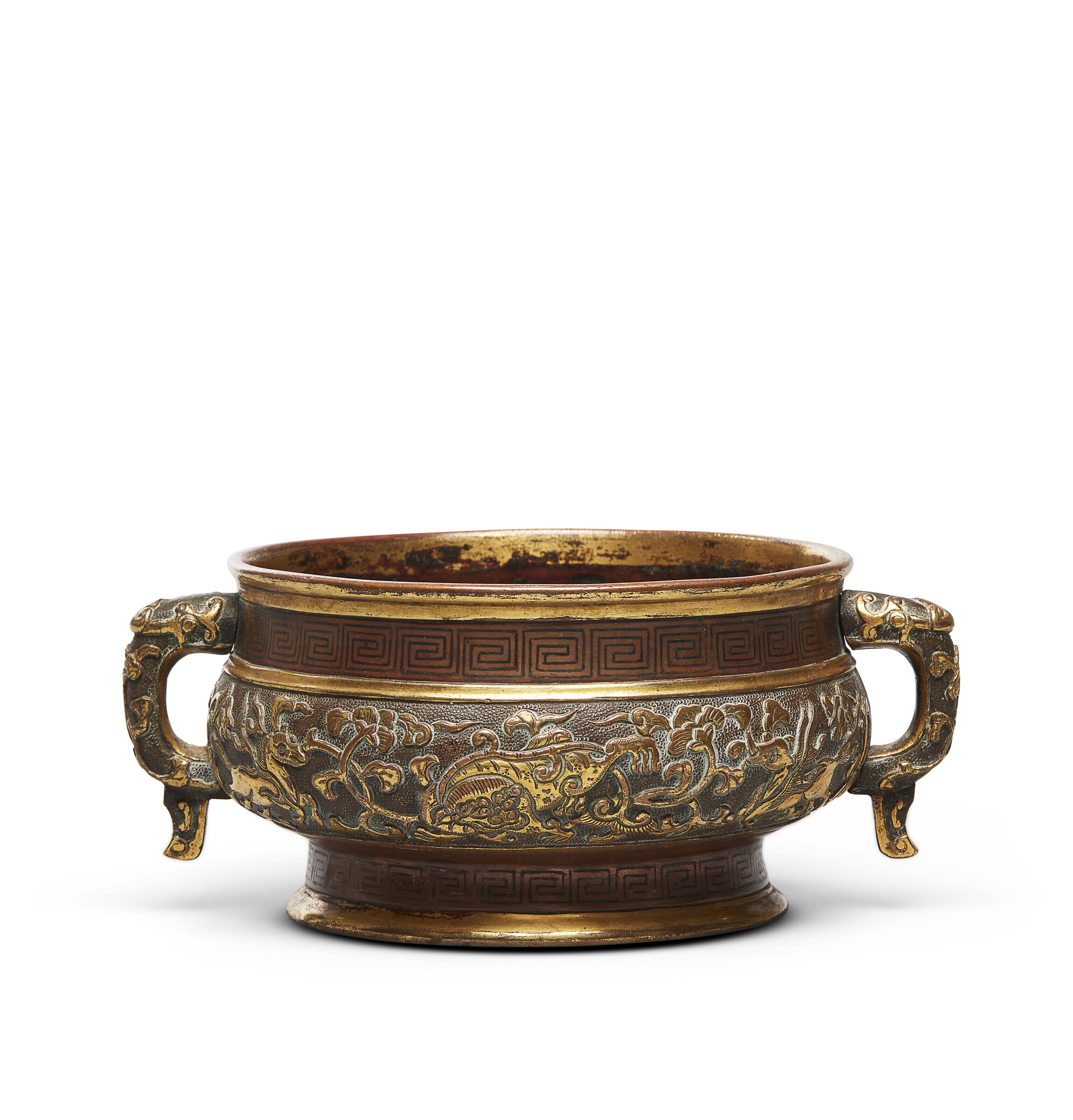 A PARCEL-GILT BRONZE TWIN-HANDLED 'MYTHICAL BEASTS' CENSER, CHINA, QING ...