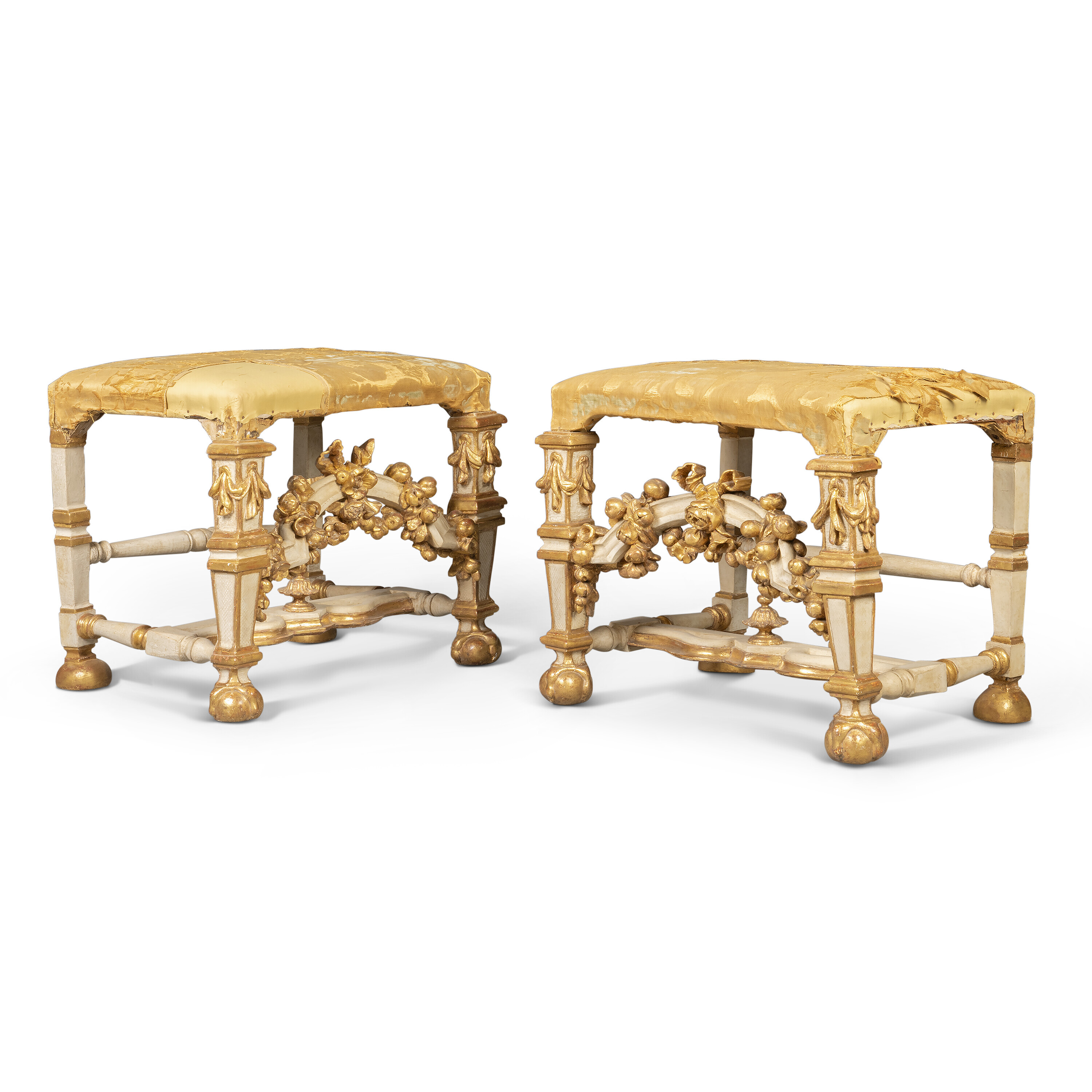 A PAIR OF BAROQUE PARCEL-GILT AND CREAM PAINTED STOOLS, PROBABLY NORTH ...